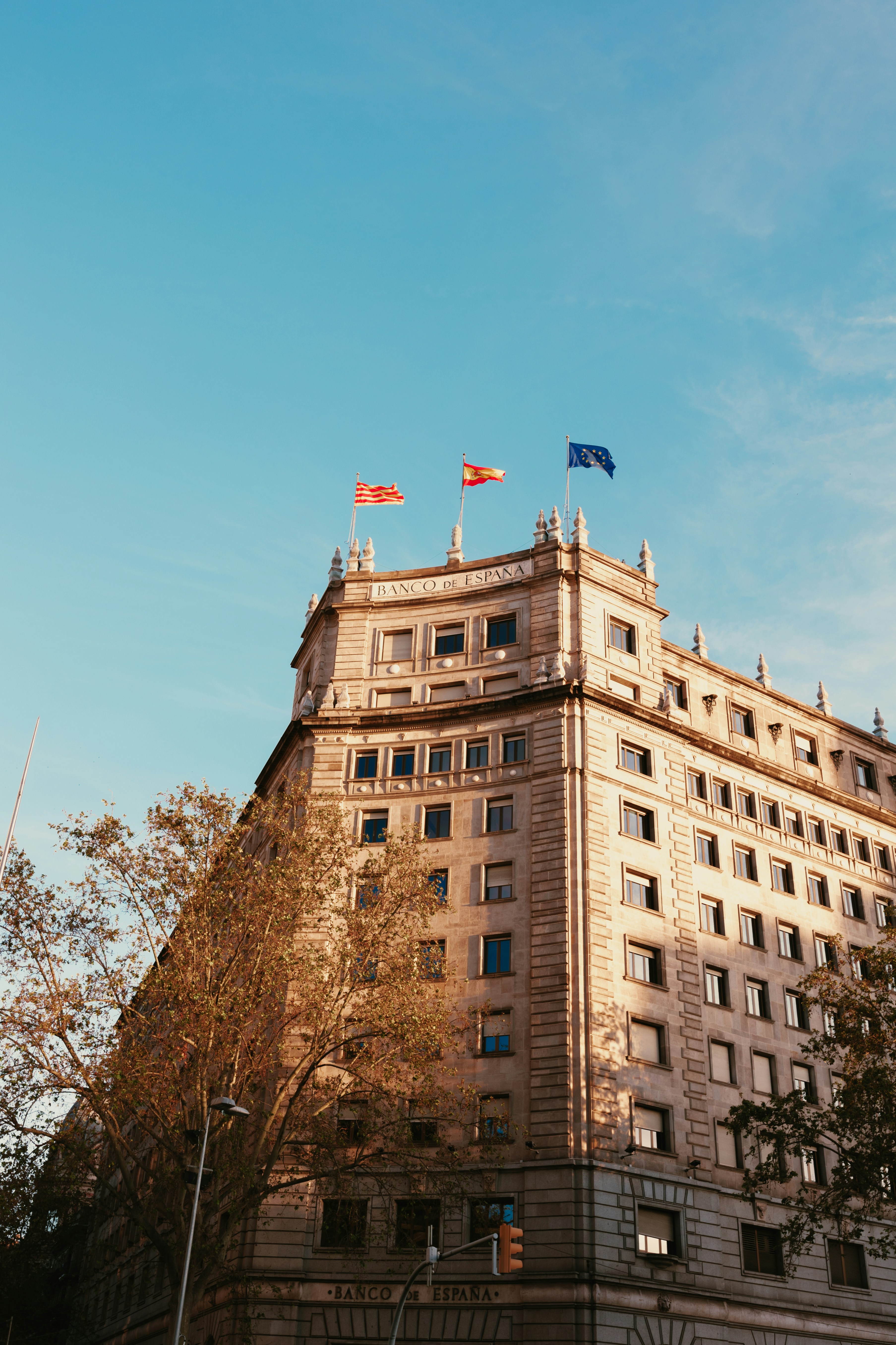 Stately Bank of Spain Building Reaching Toward a Clear Sky