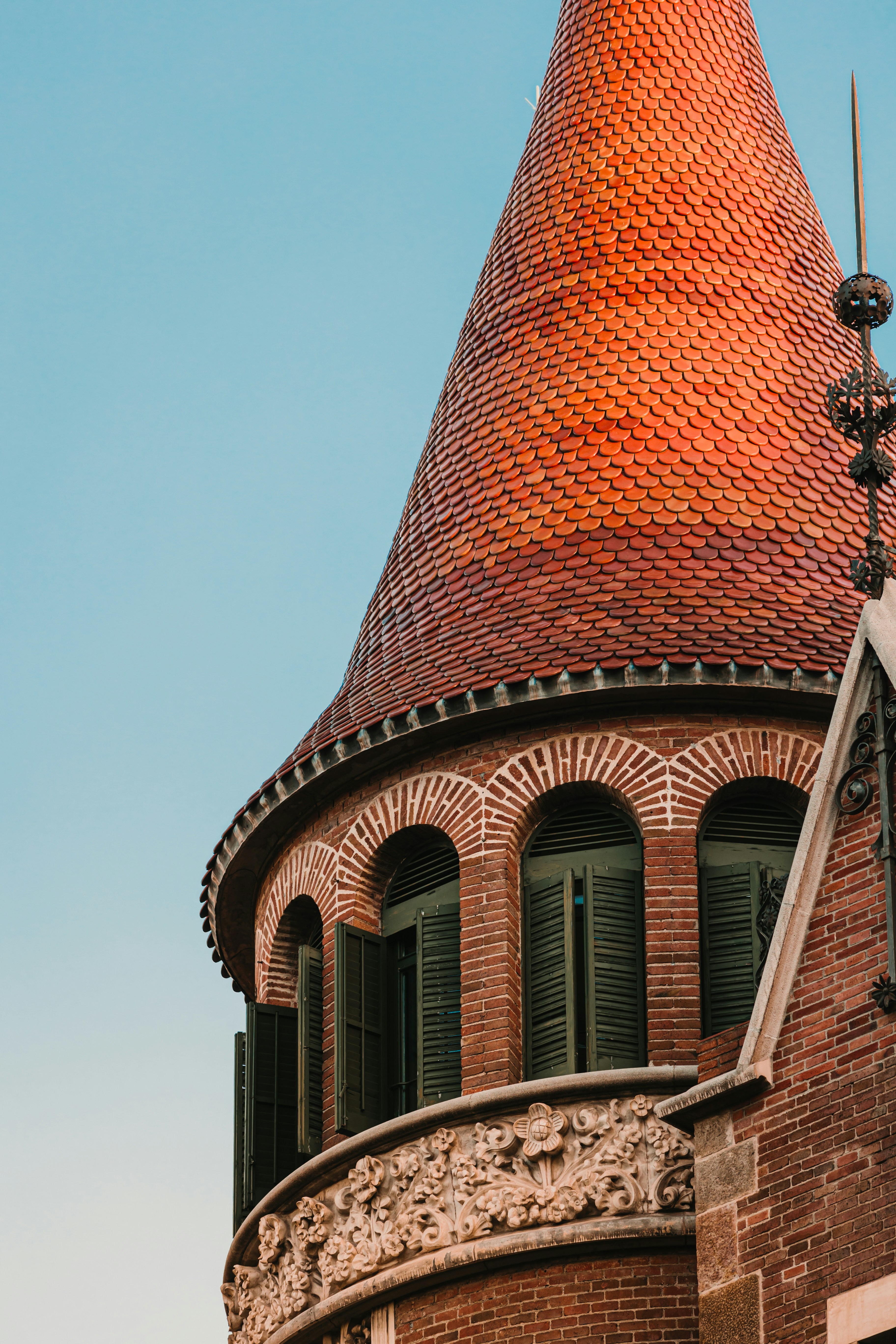 Towering Brick Roof: A Plaid of Tiles and Arches