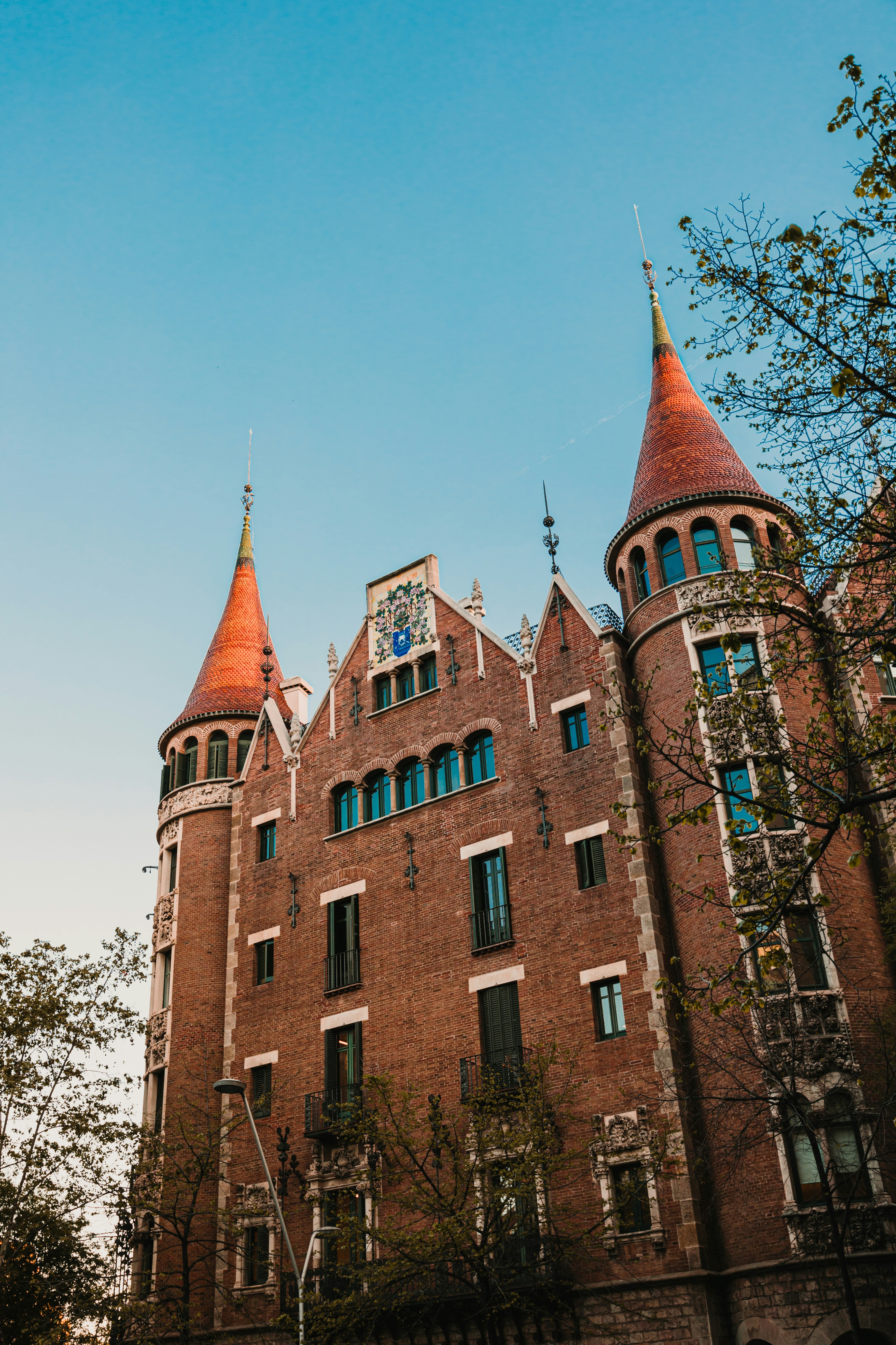 Brick Castle Awash in Blue: A Dutch-inspired Turreted Facade Under Open Sky