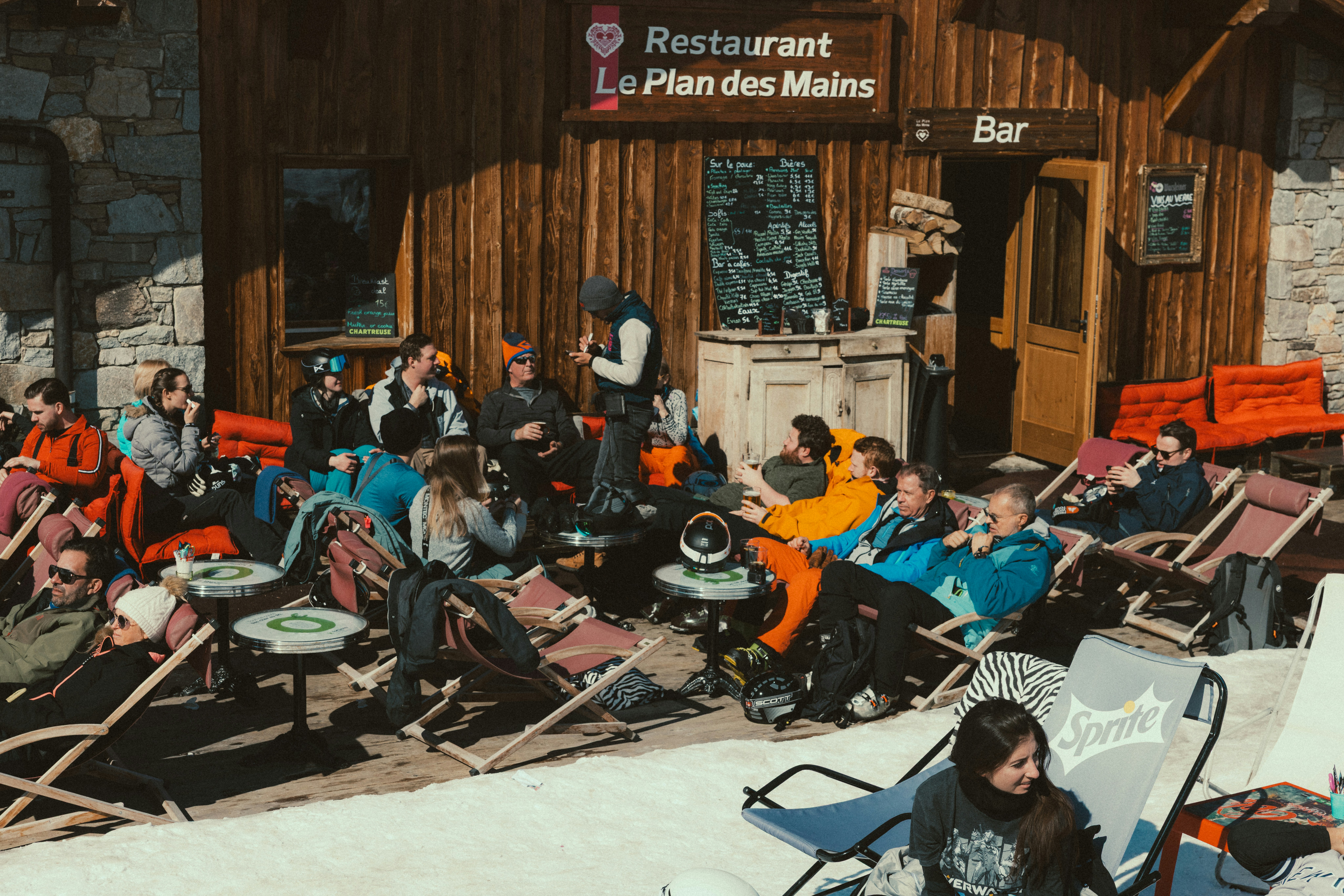 Relaxed Snow-Chair Assembly: Sunlit Lounge at a Mountain Café