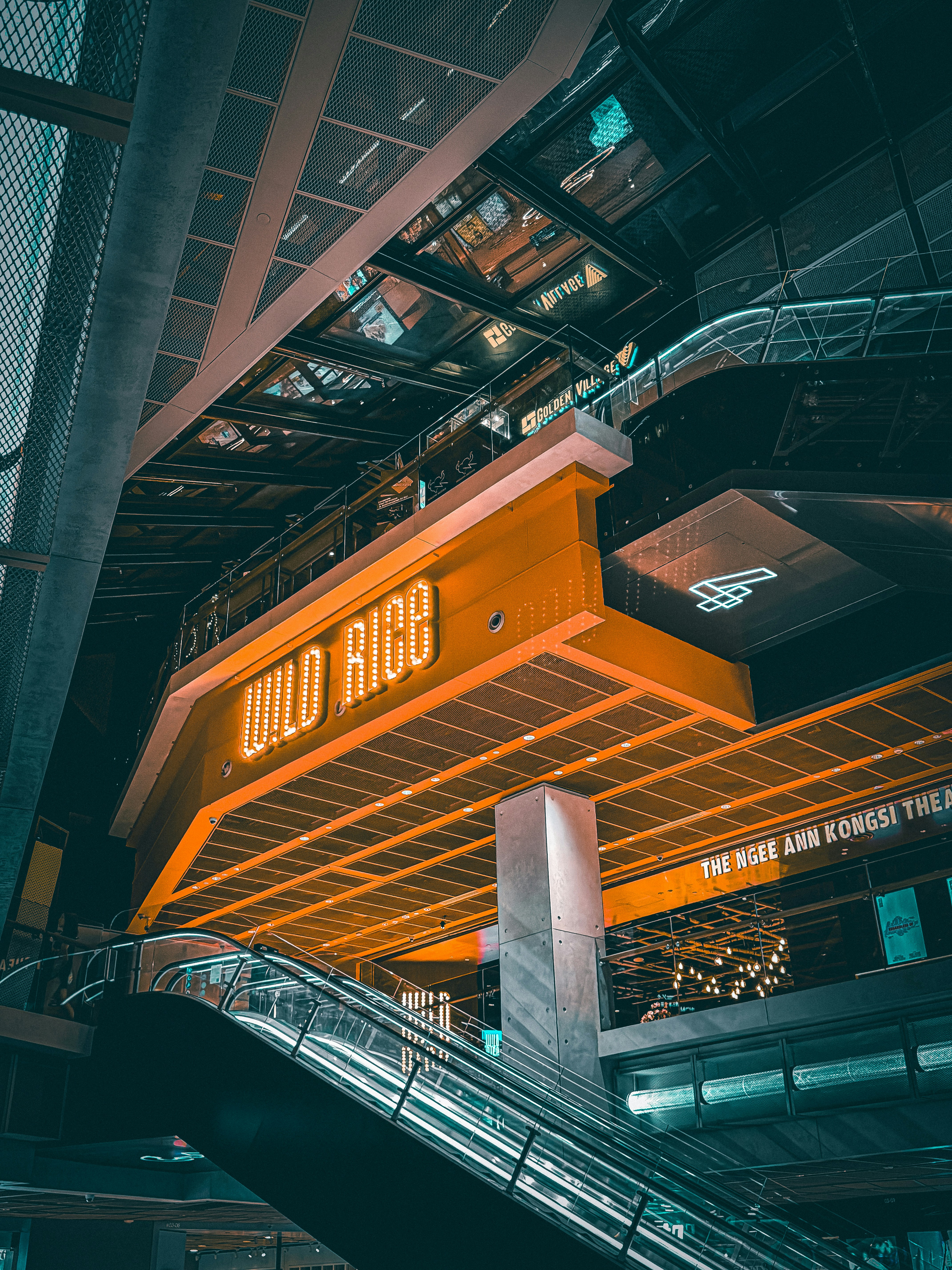 Glowing Centerpiece: Orange Sign in Modern Atrium