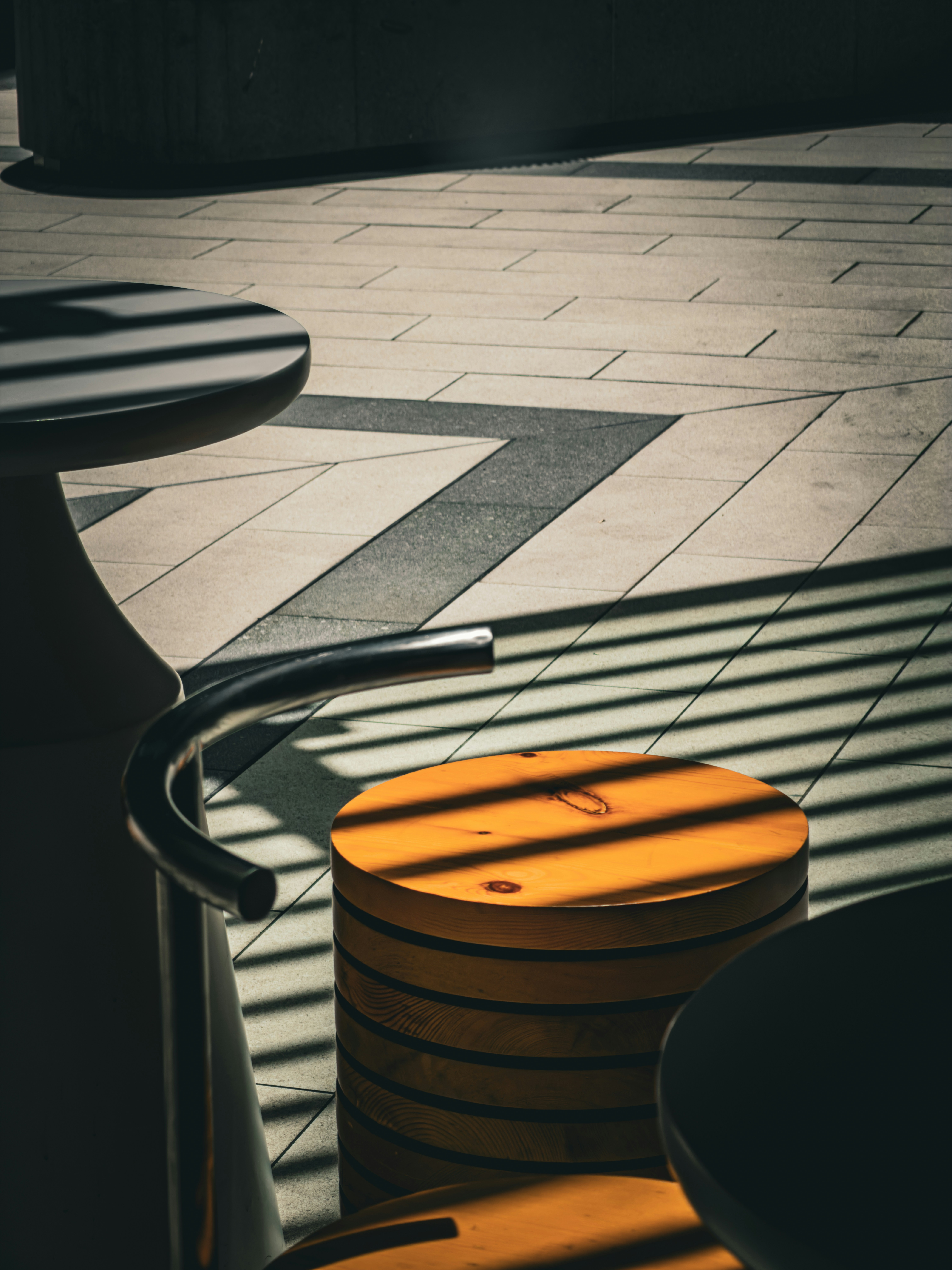 Sunlit Shadows on Striped Tiles