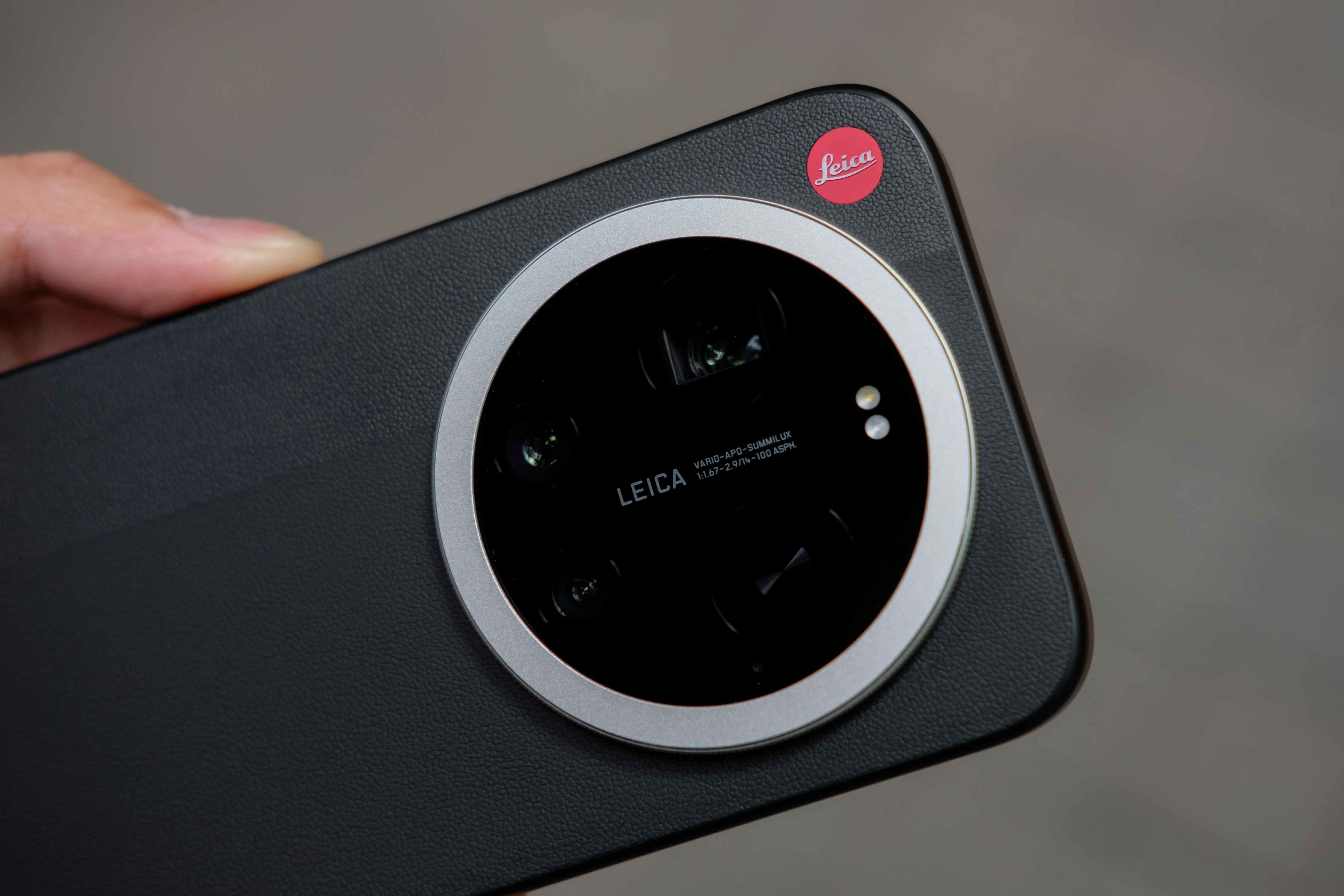 Close-Up of a Leica Circle: A Smartphone Camera with Iconic Red Dot