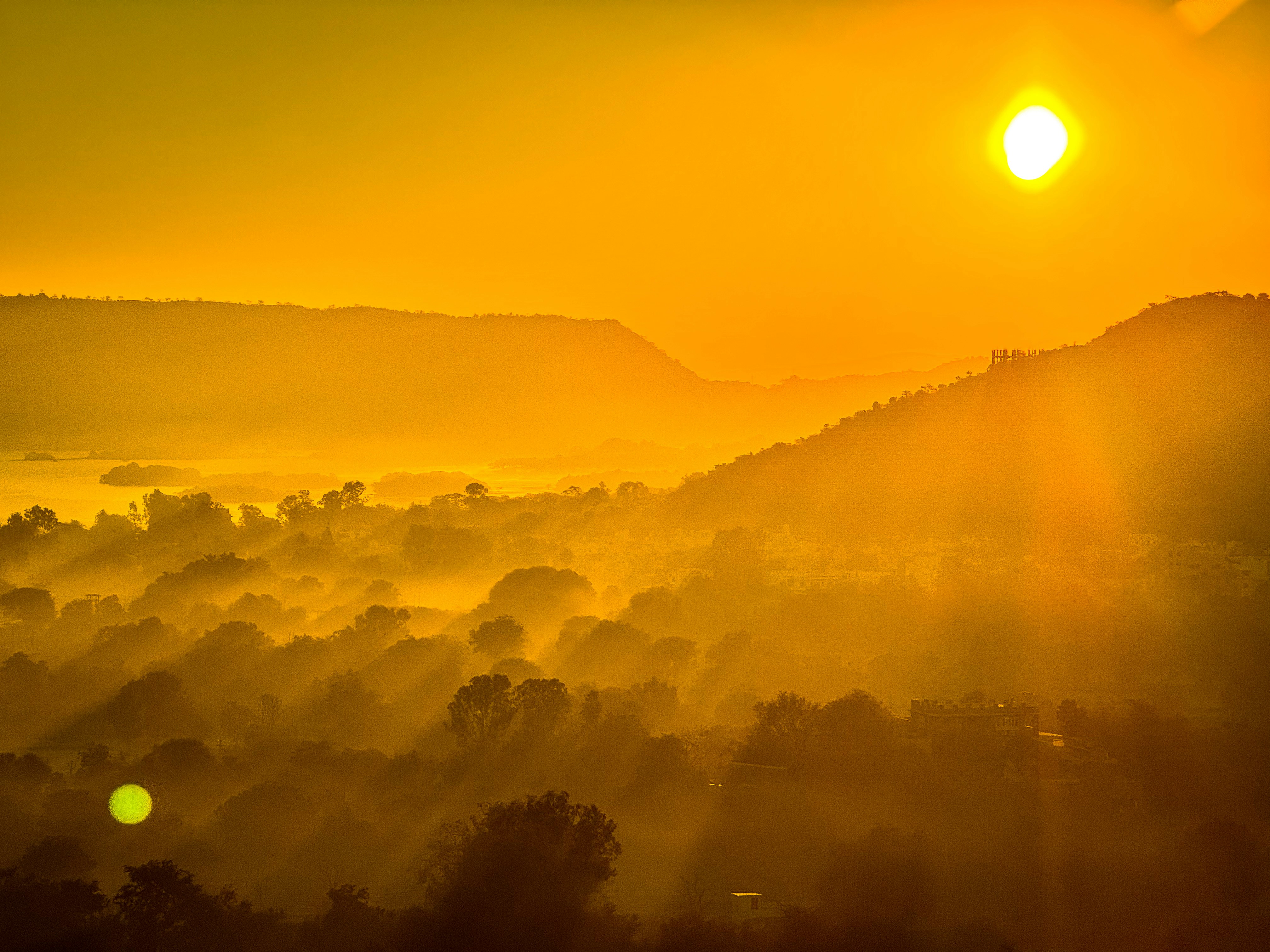 Golden Valley at Dawn: Rays Break Over Misty Hills