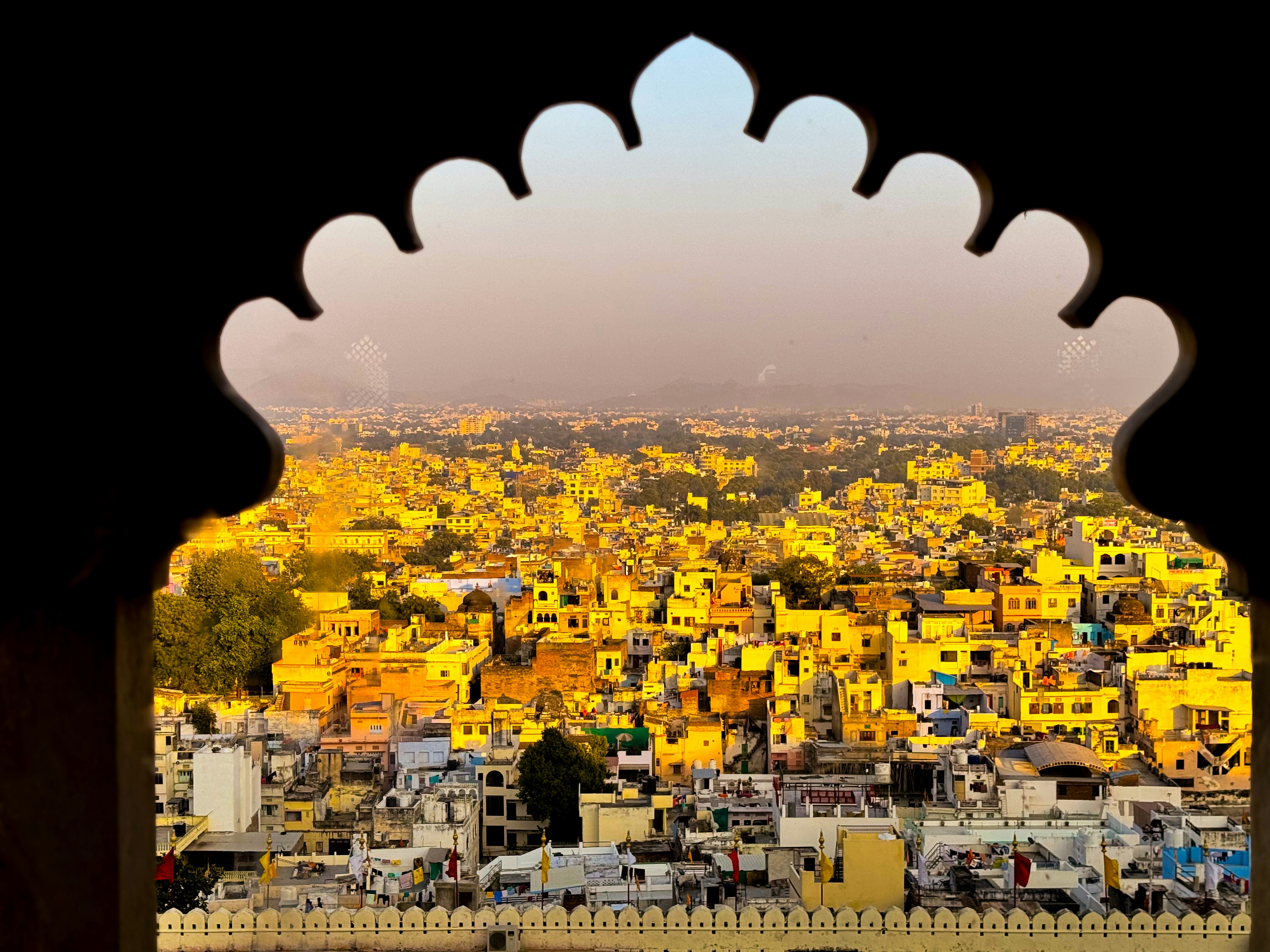 Golden City Frames: A Sunlit Tapestry Through an Ornate Arch
