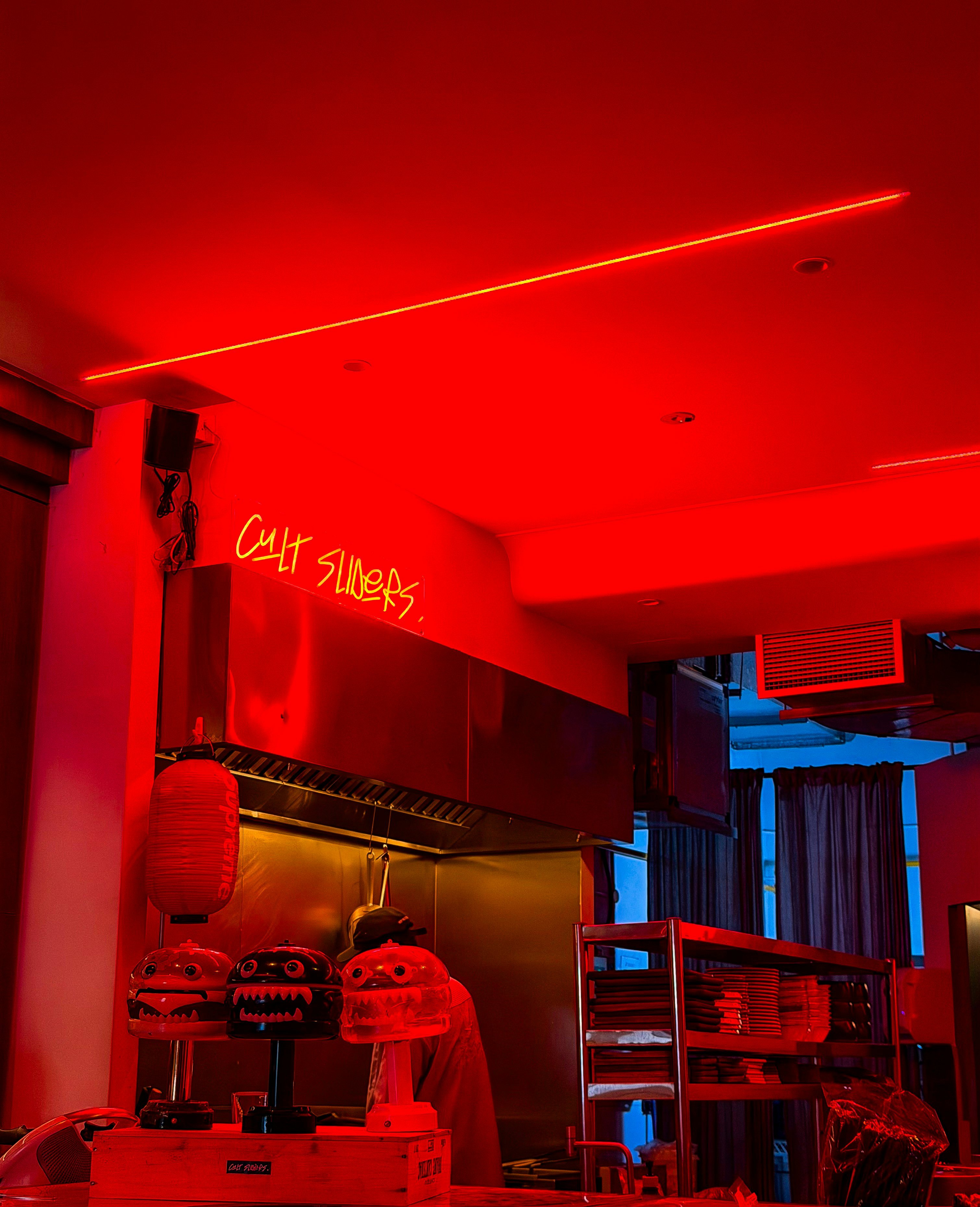 Neon Kitchen at Night: Red Light, Quiet Steam