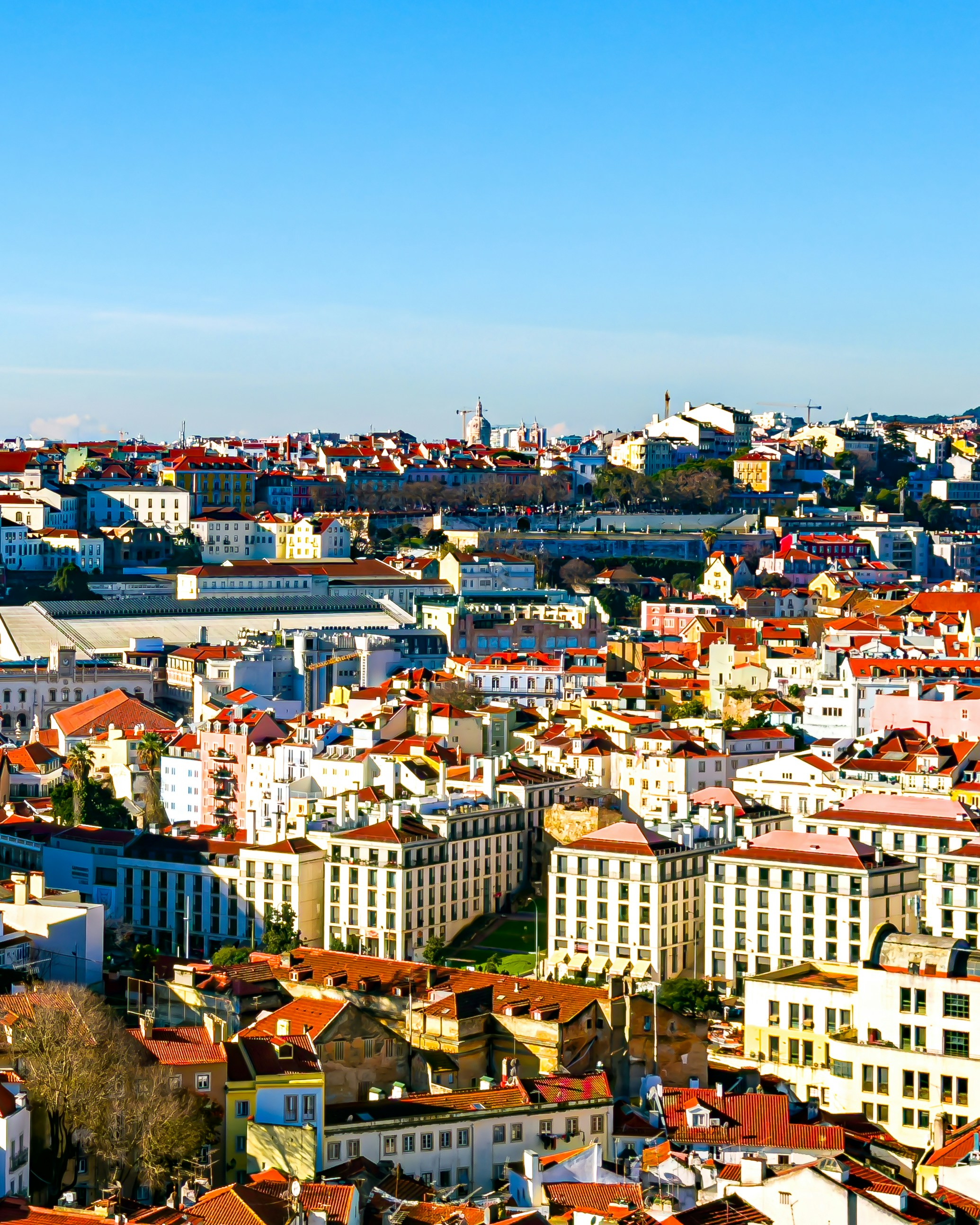 Sunlit Low-Rise Tapestry: A European Cityscape from an Elevated View