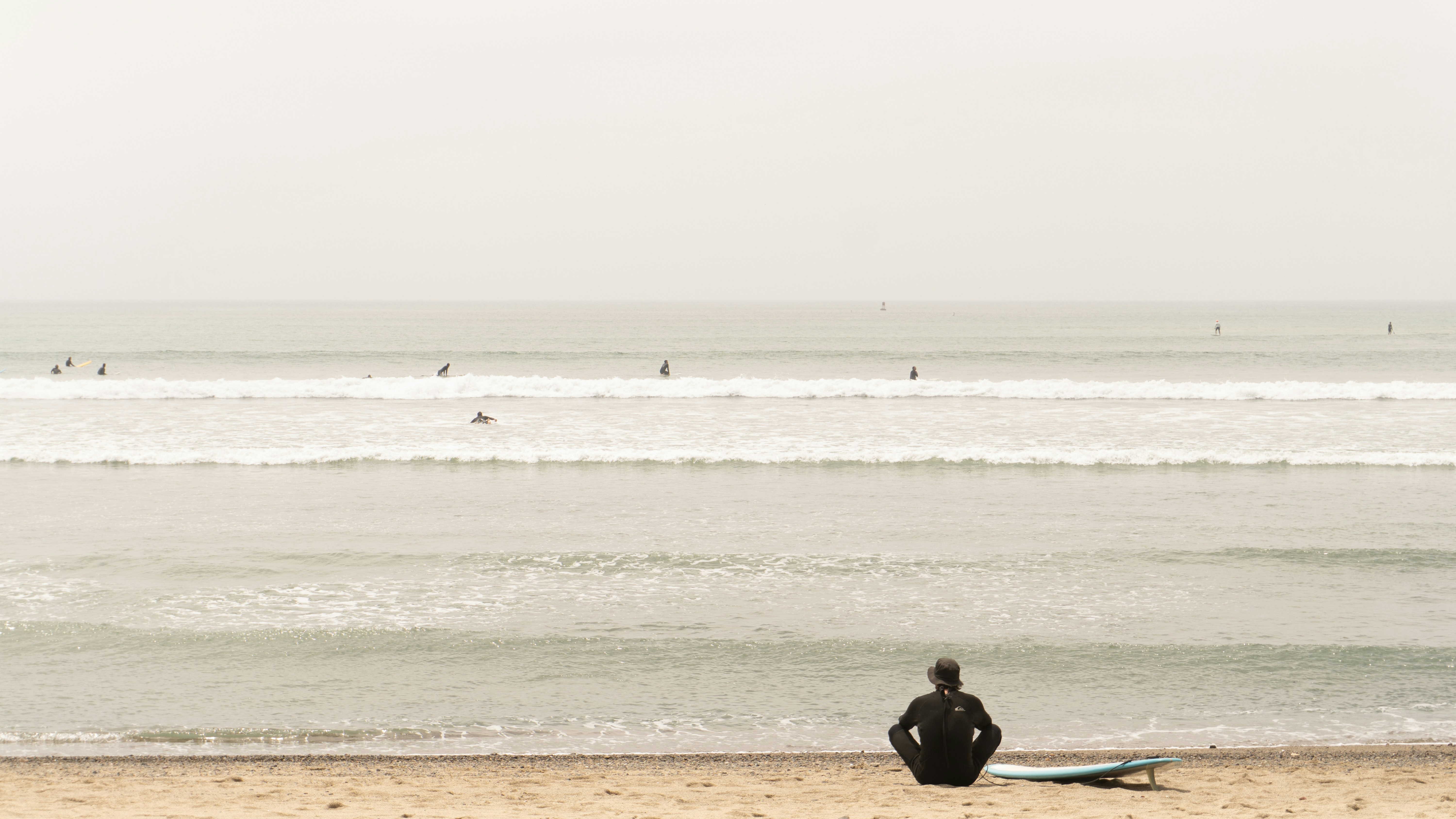 Solo Surfer at the Edge: Quiet Horizon and a Boardbound Moment