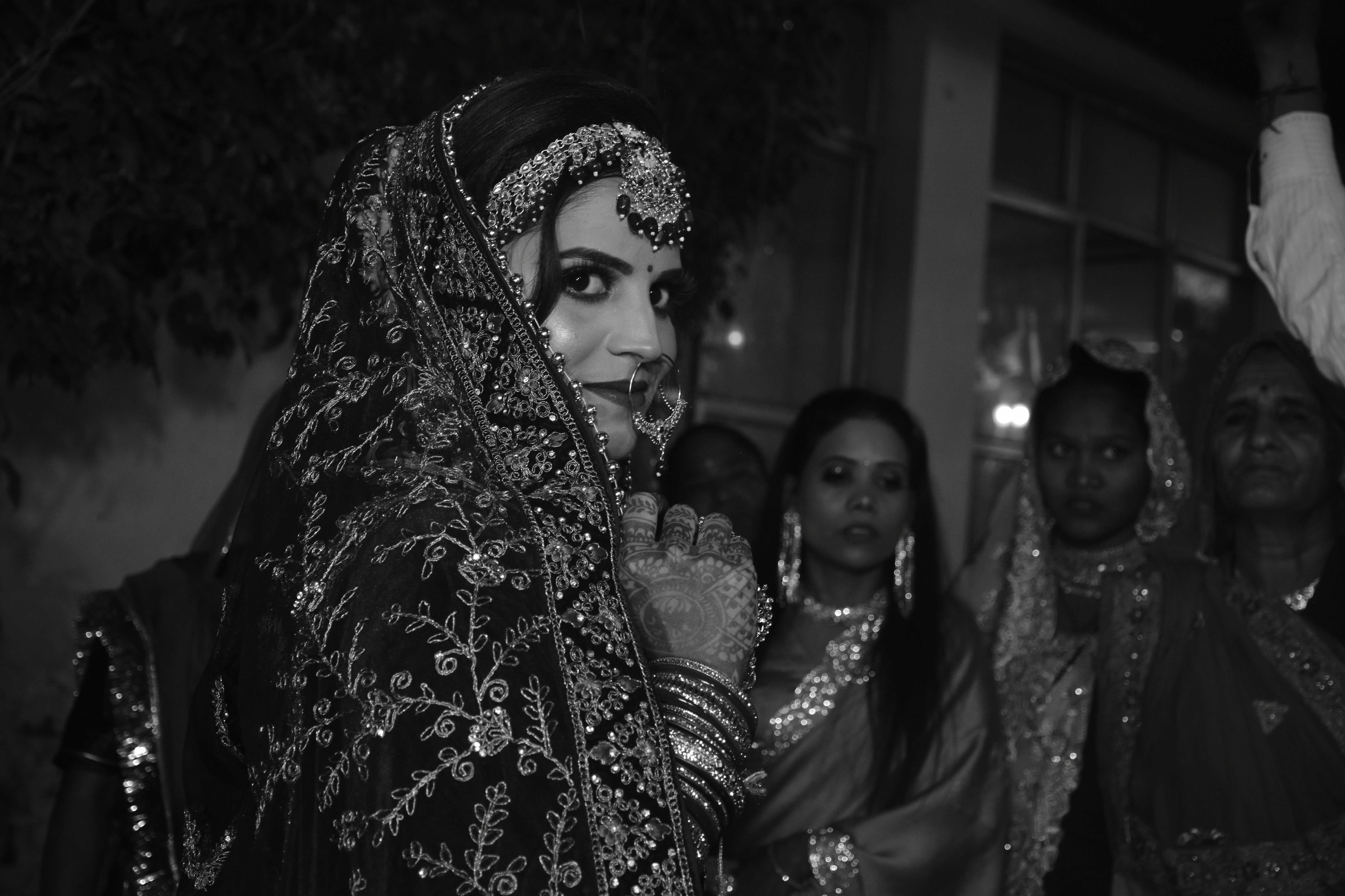 Silent Bride in Velvet Lace: A Traditional Moment in Dim Light
