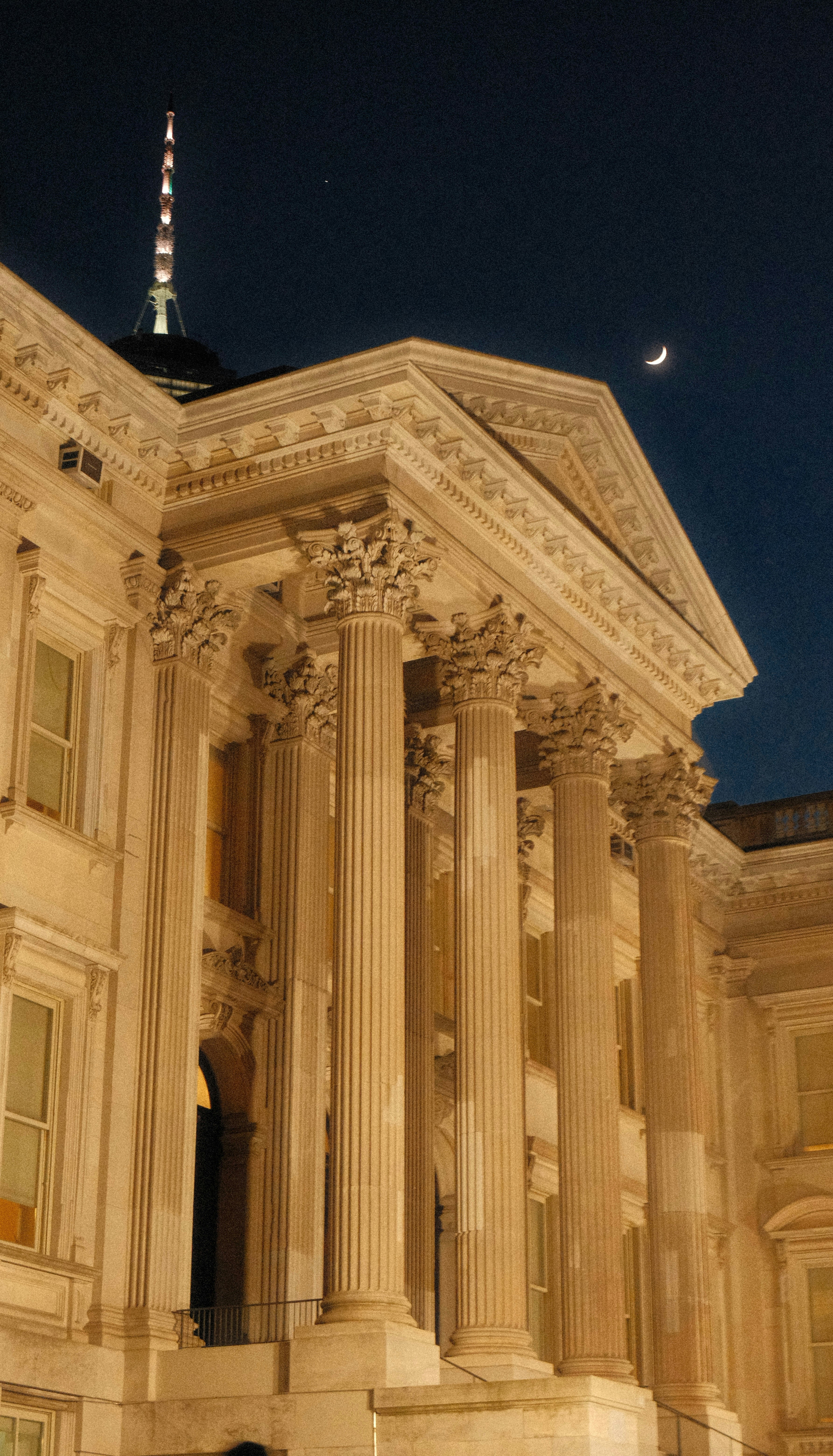 Moonlit Neoclassical Facade Under a Quiet Night Sky