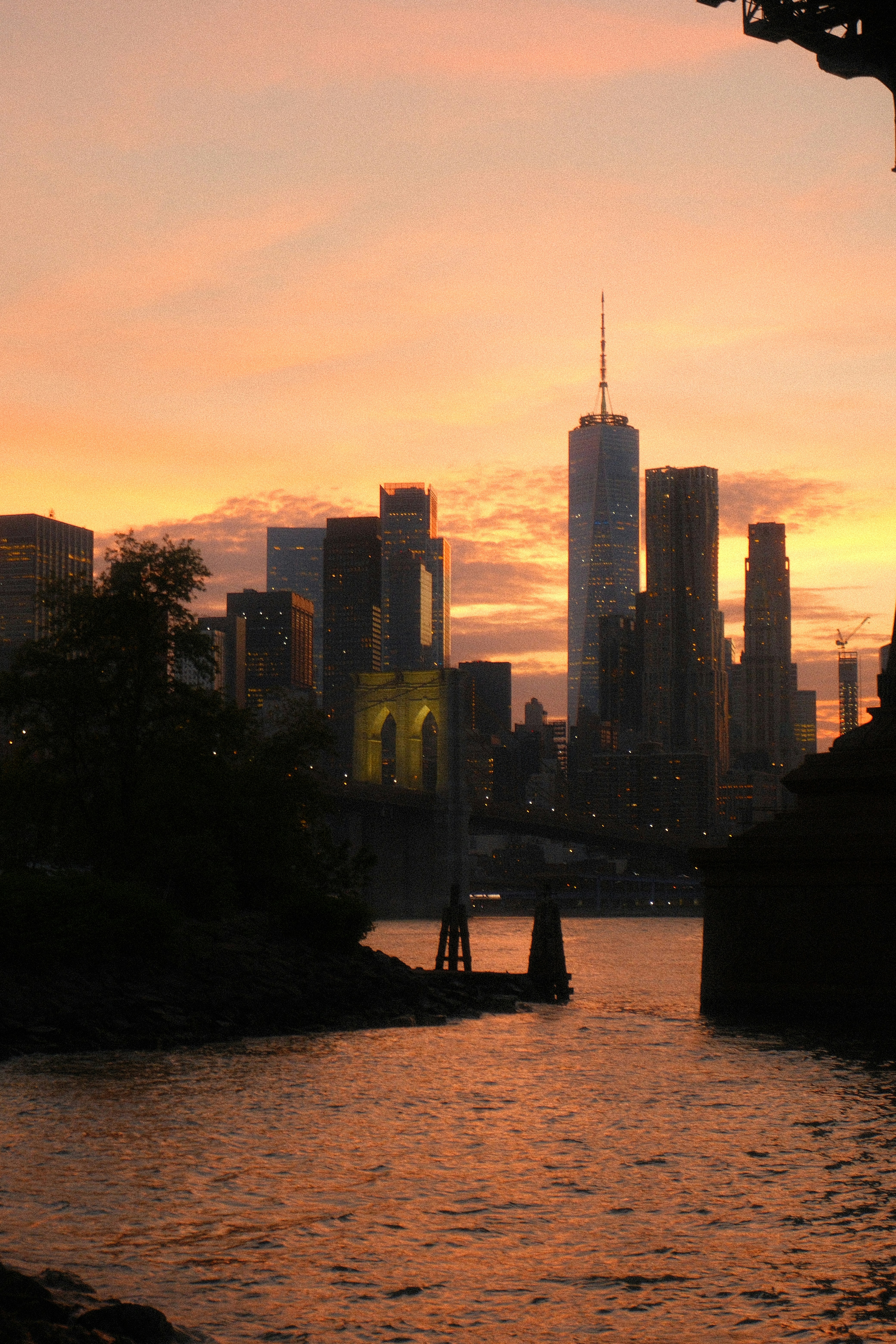 Sunset Skyline Over the River: Brooklyn Bridge Silhouette
