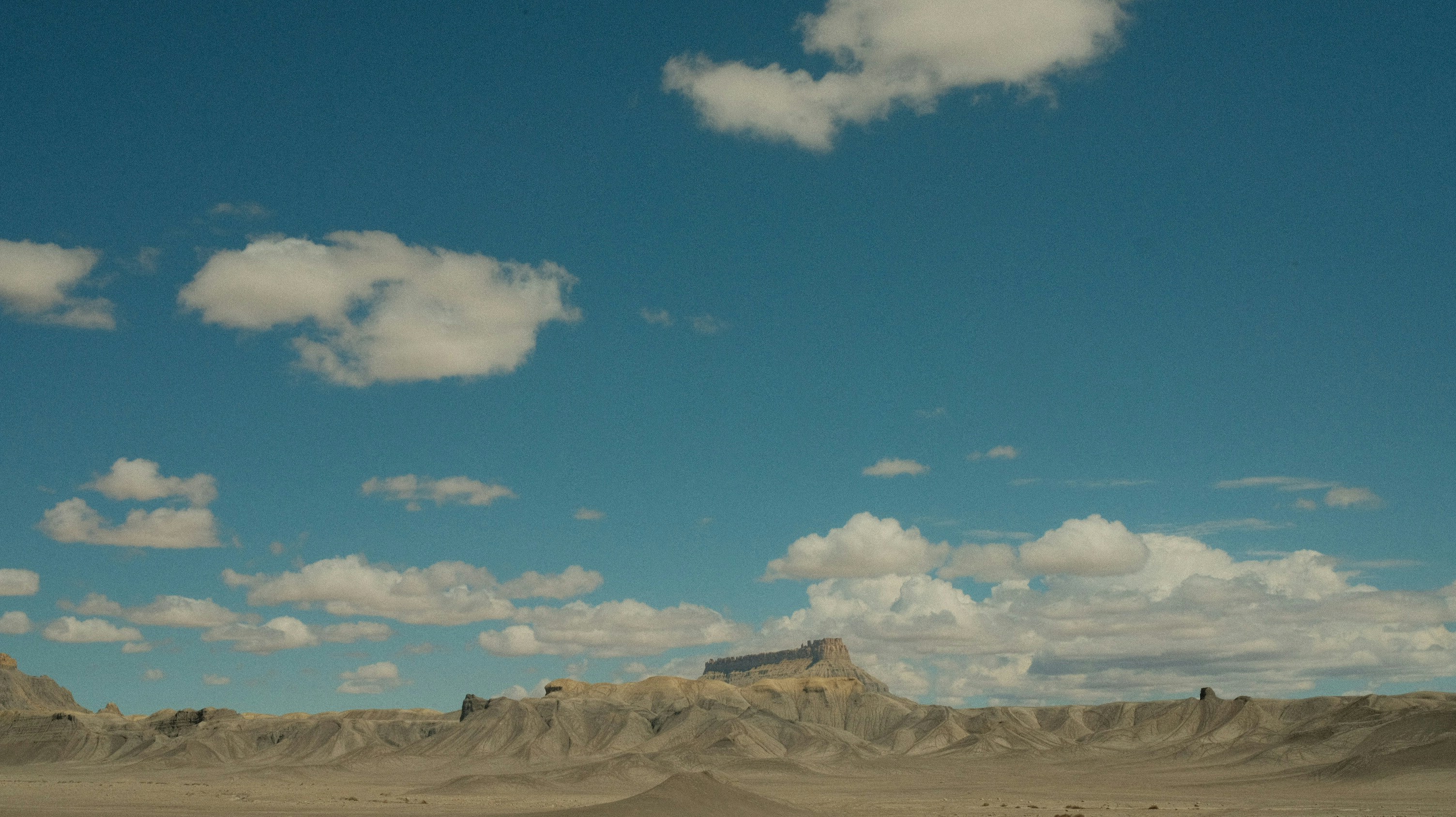 Desert Facade: Windswept Dunes Beneath a Striking Sky