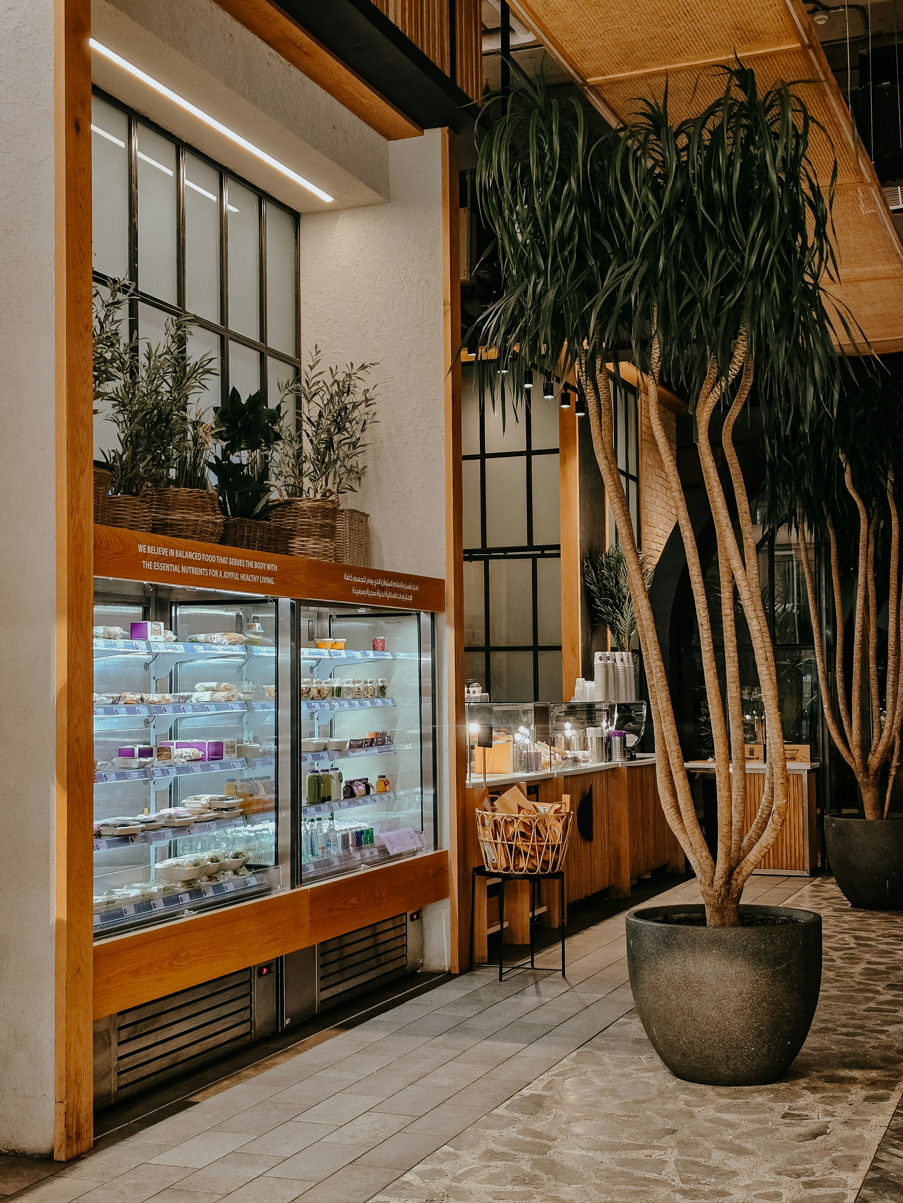 Warm glow by a cafe display: a quiet indoor pastry corner