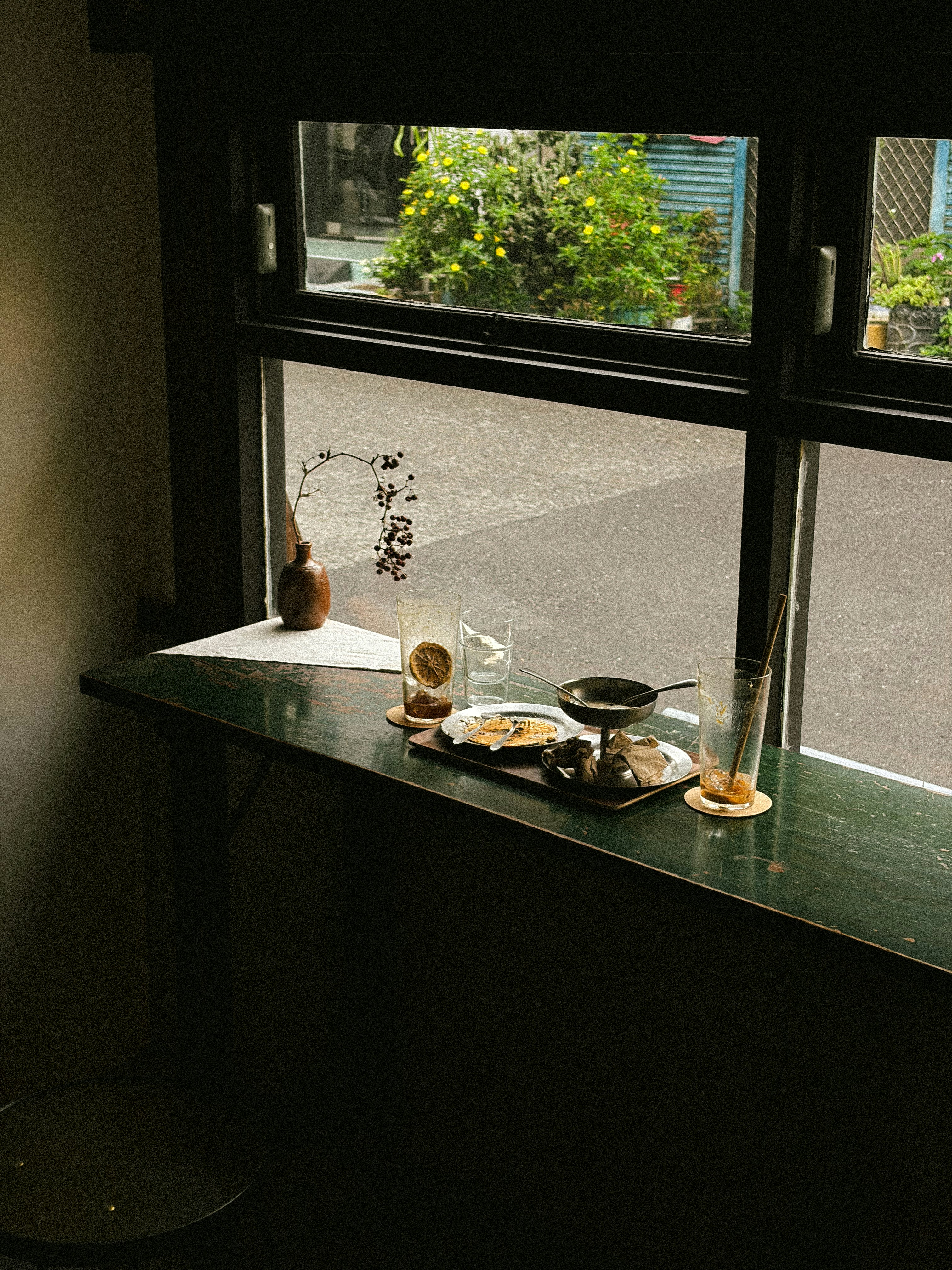 Window-side Tranquility: A Quiet Table by the Street