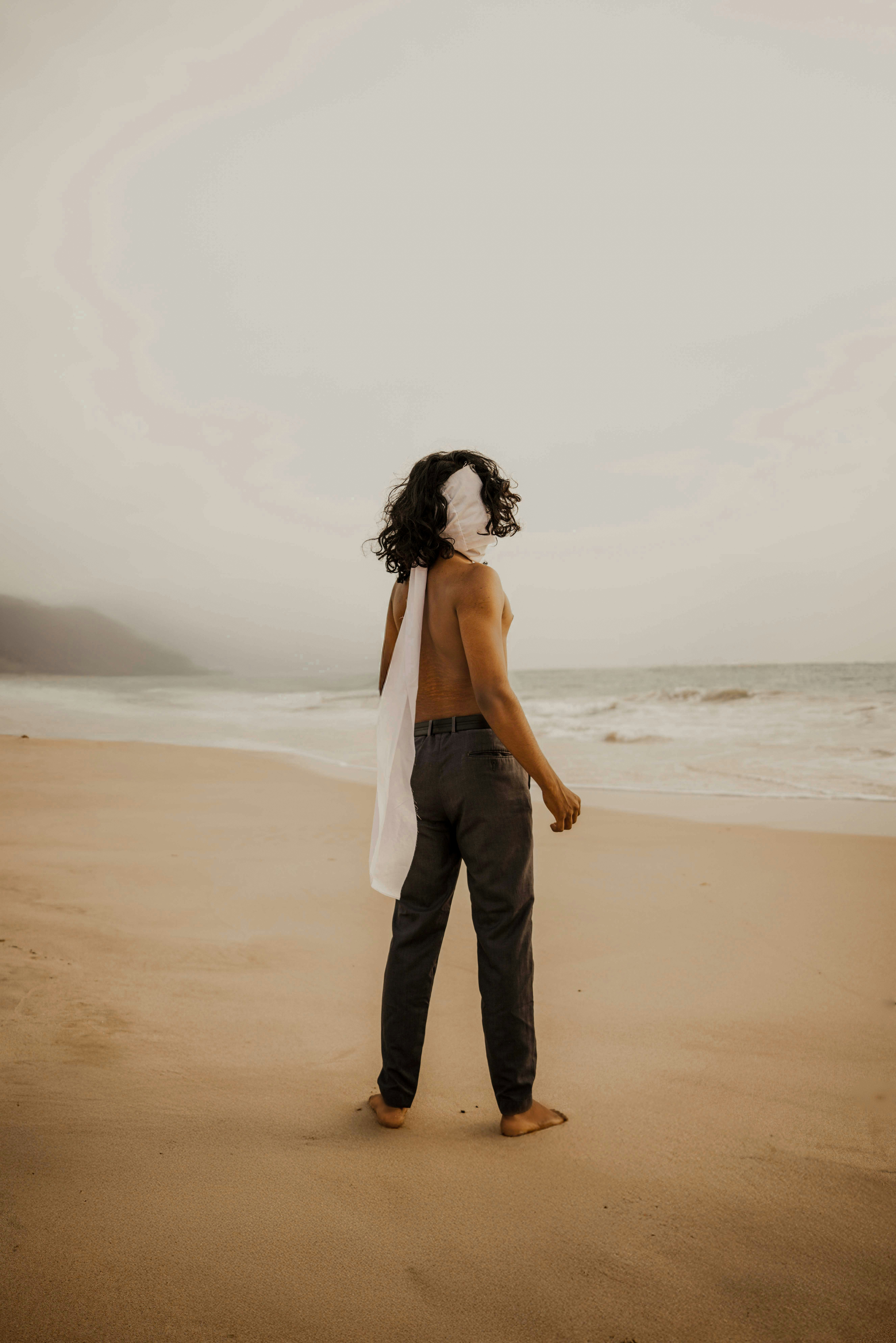 Windward Stillness: A Silhouette at the Shore
