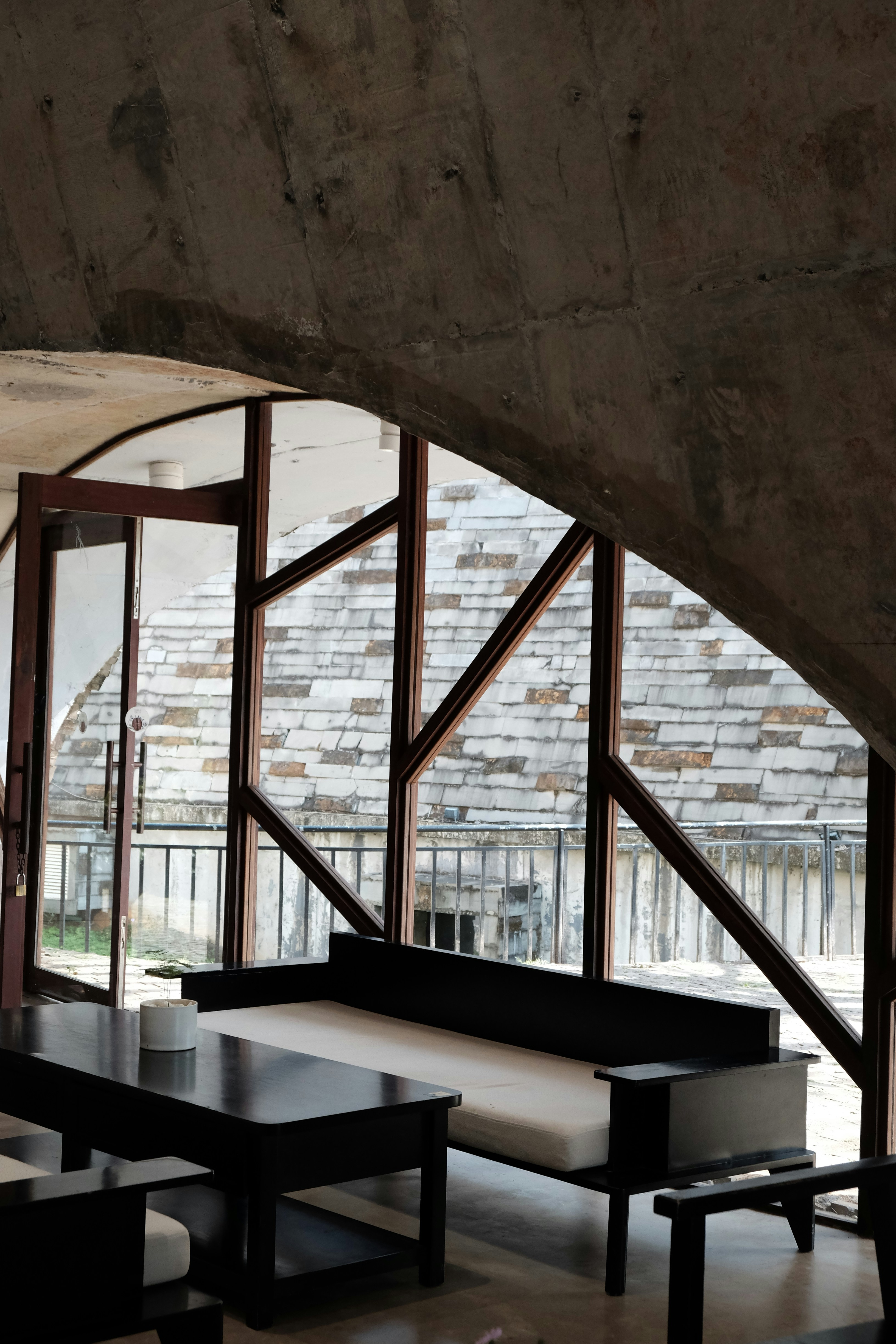 Modern interior with arched ceiling, geometric windows, and sleek ...