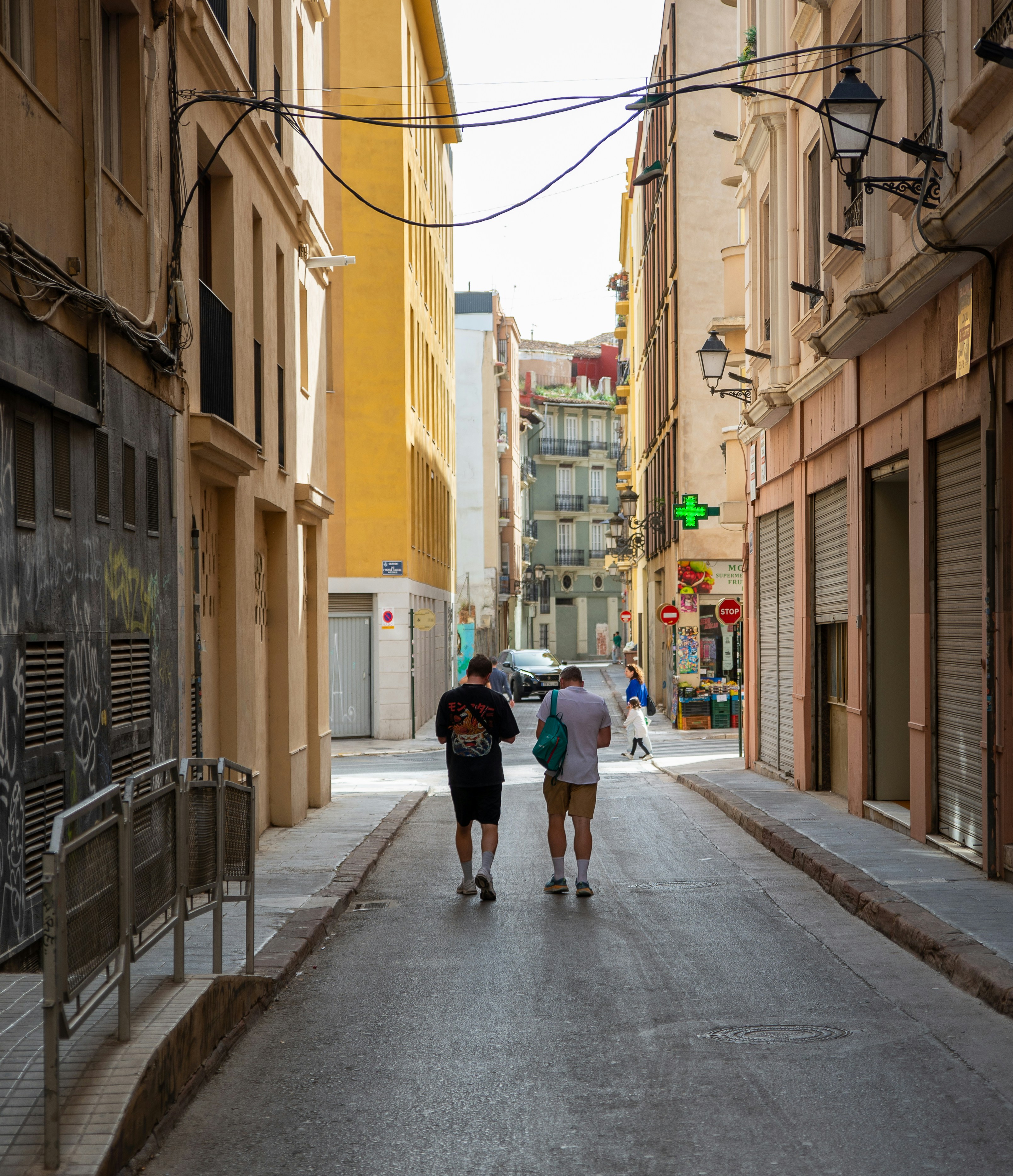 Two Wanderers in a Sunlit Callejon