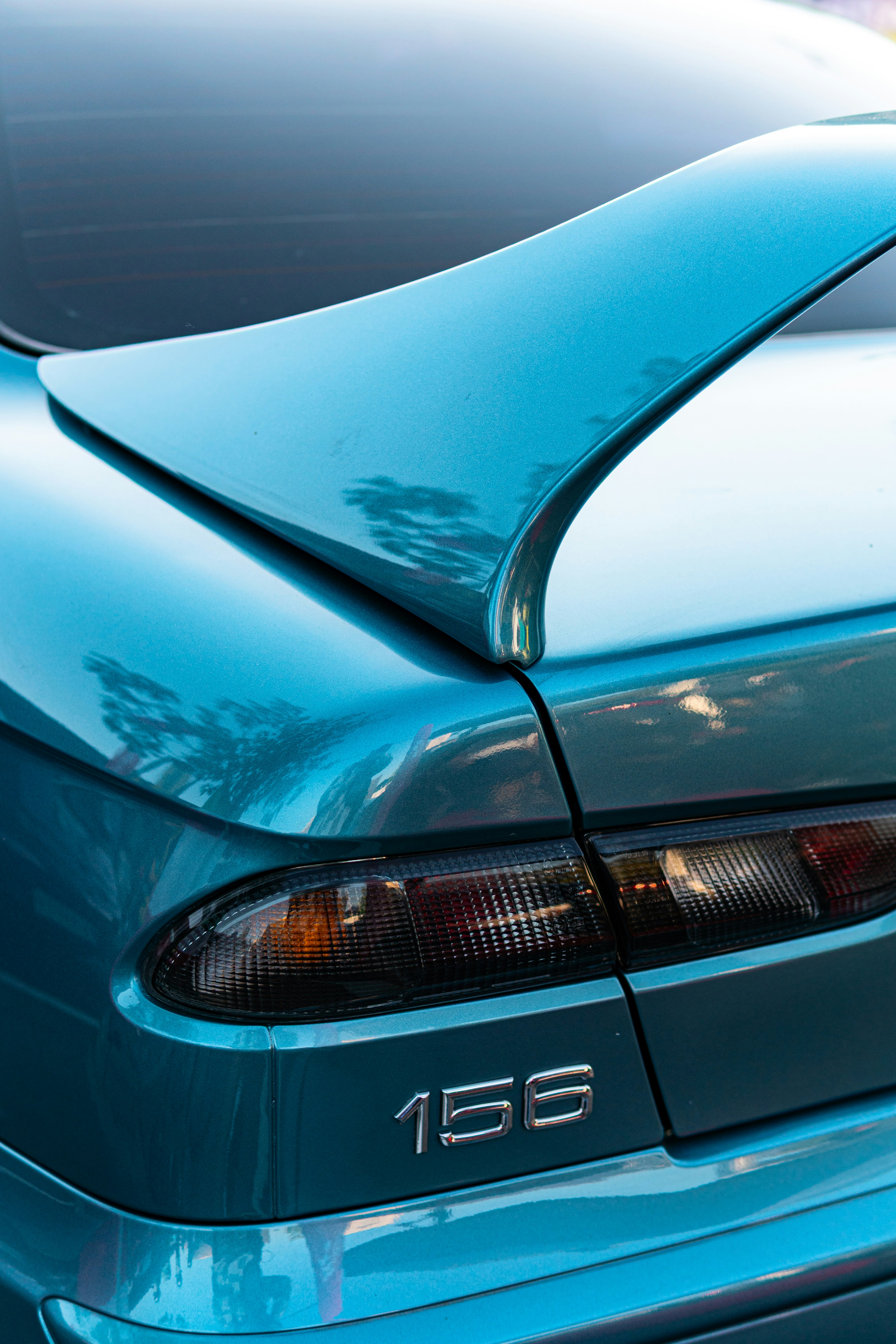 Blue Sculptered Spoiler: Emblematic Rear of a Sports Sedan