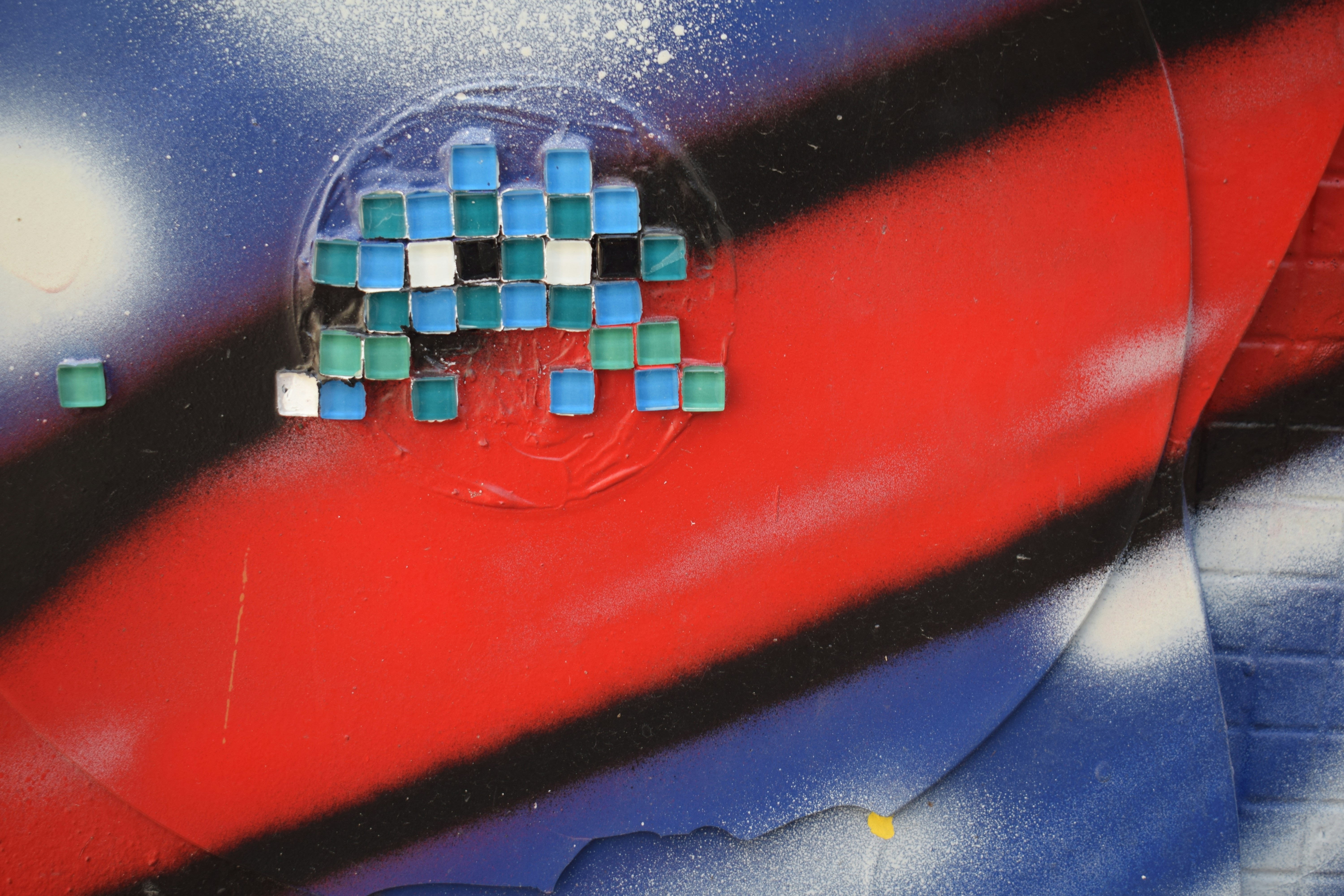 Checkerboard Tile Burst on a Graffiti Canvas