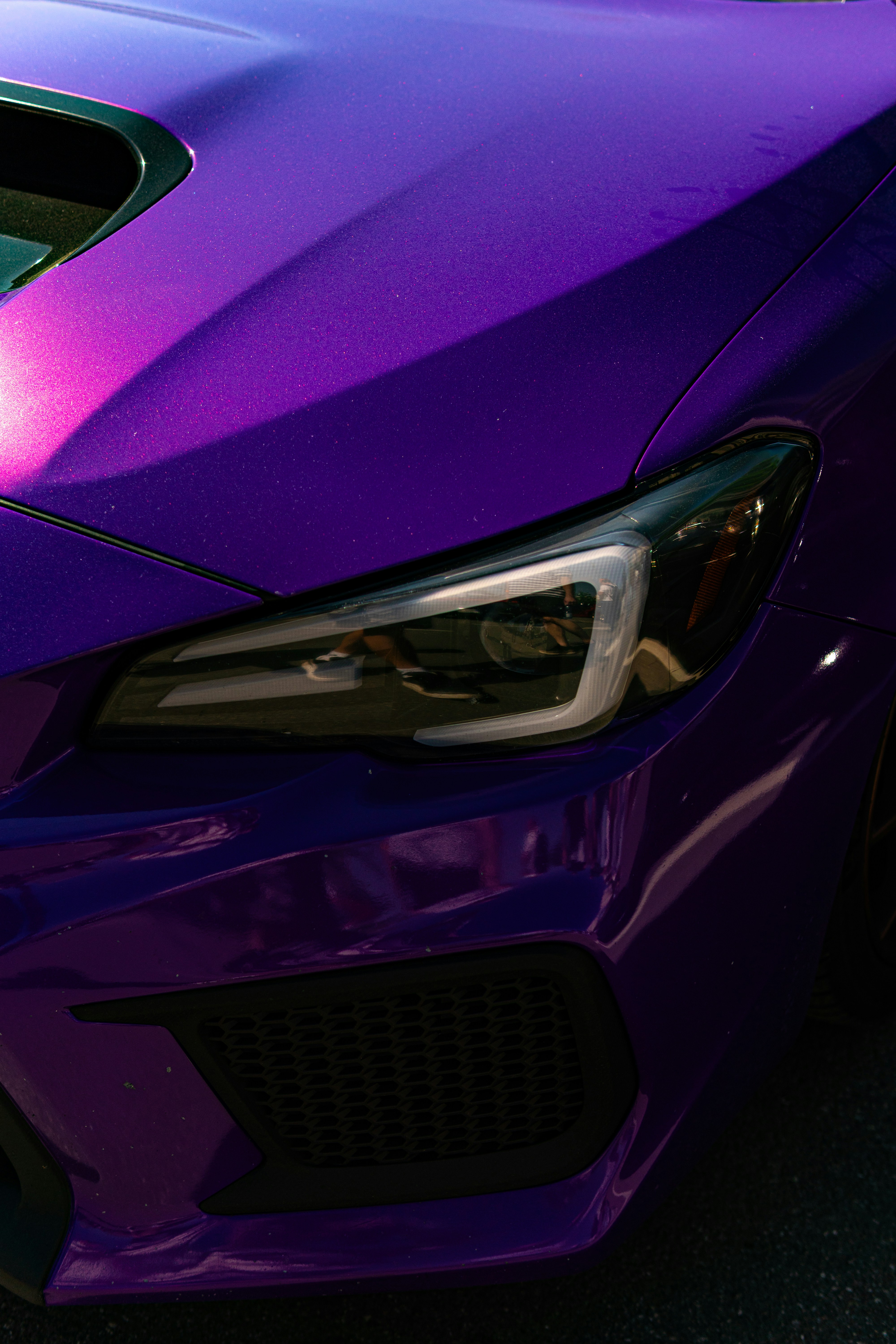 Vibrant Purple Aggressor: Front-Quarter of a Sport Lancer
