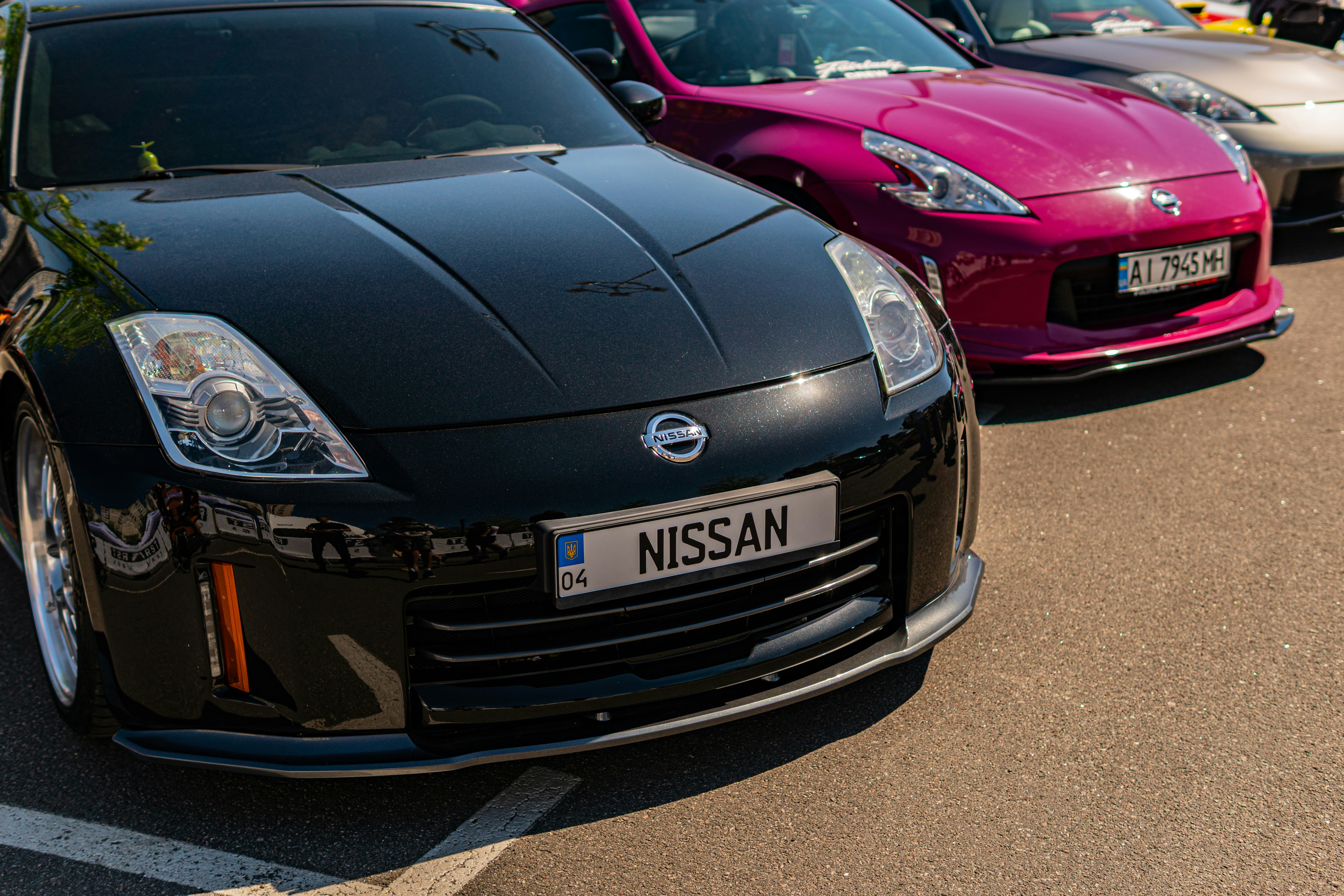Chrome Meets Asphalt: The Nissan Z Lineup in a City Parking Glow