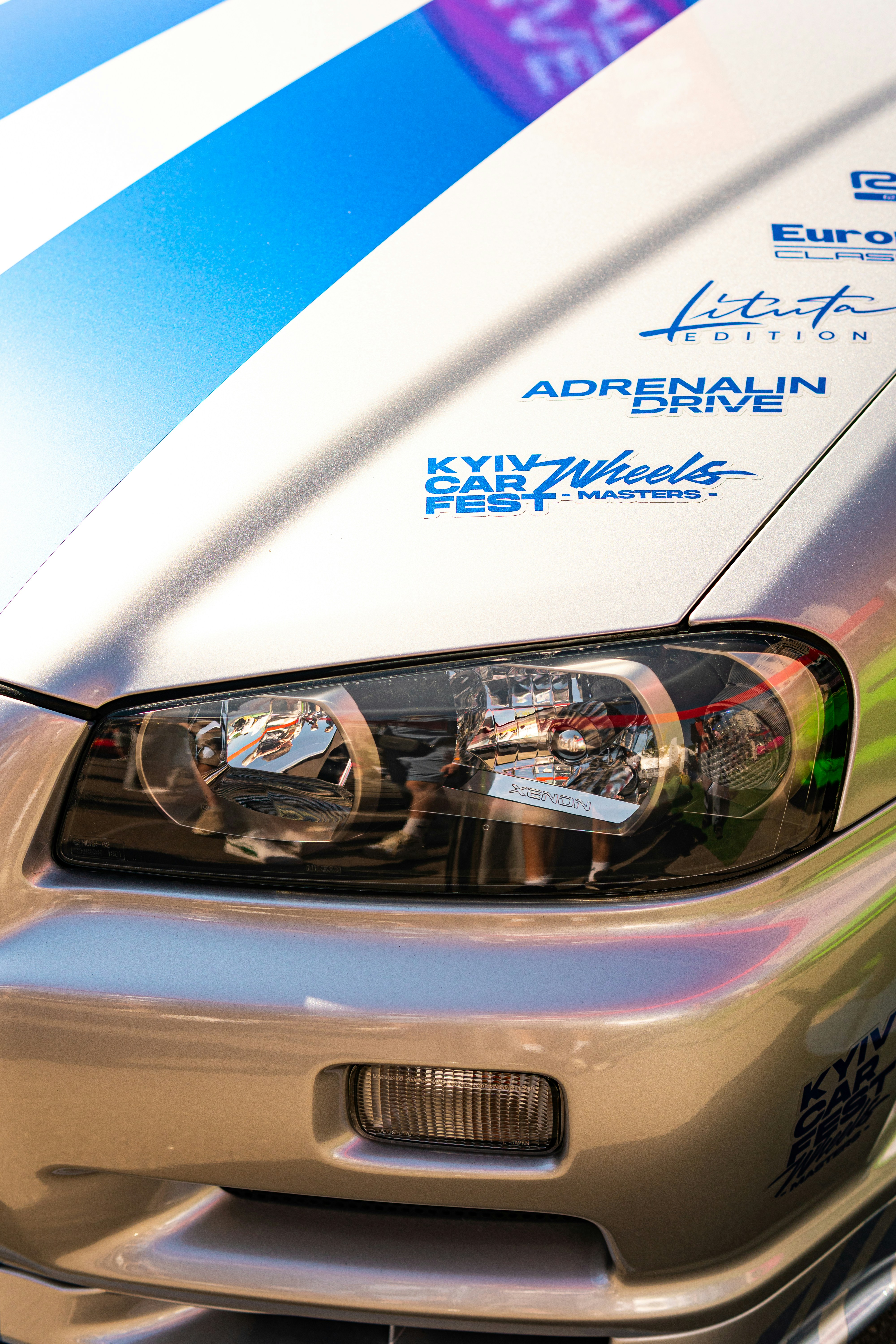 Metallic Silver Drift: Close-up of a Race-Edition Car Nose and Headlight