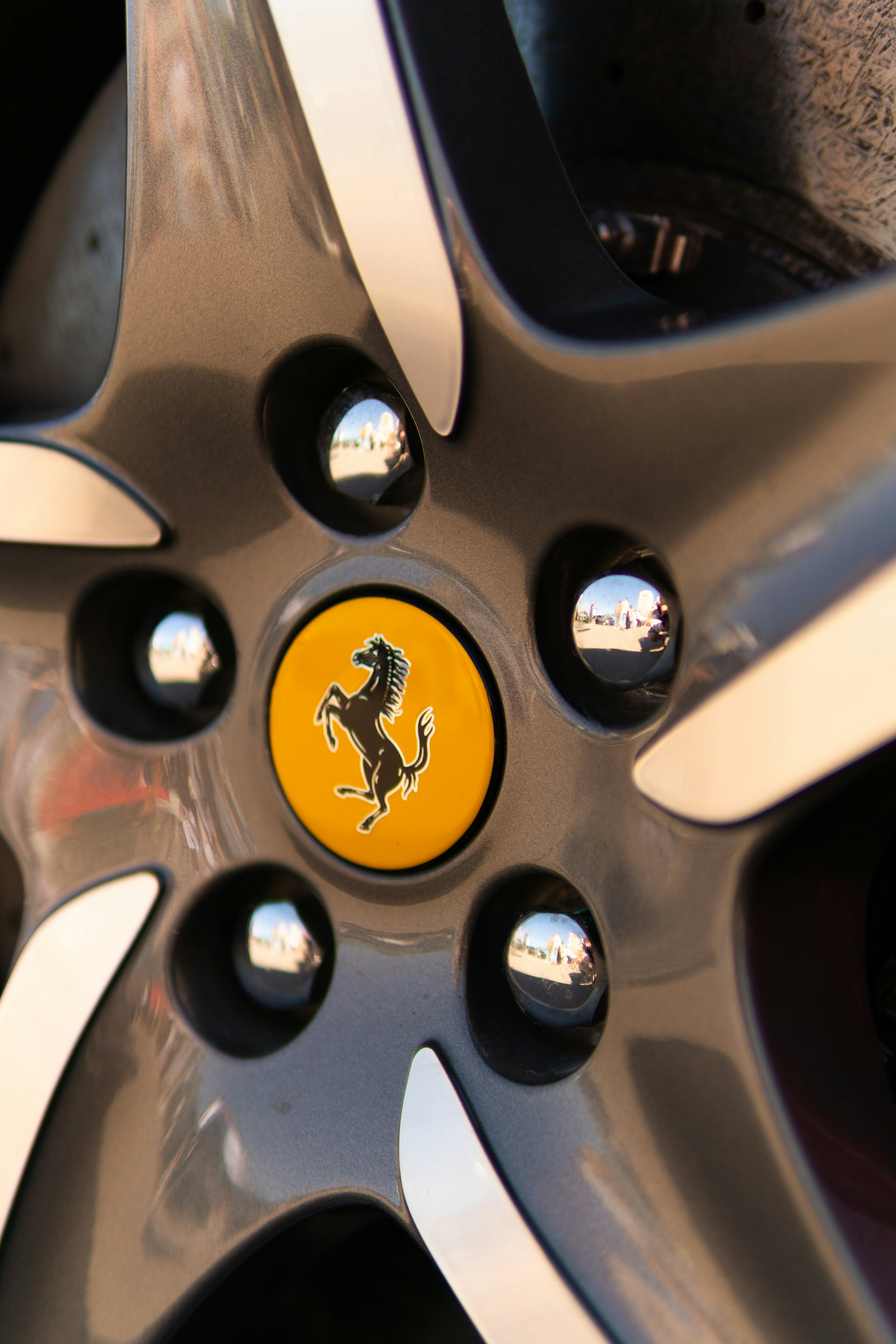 Ferrari Crest in Sharp Focus: A Close-Up of the Wheel Center