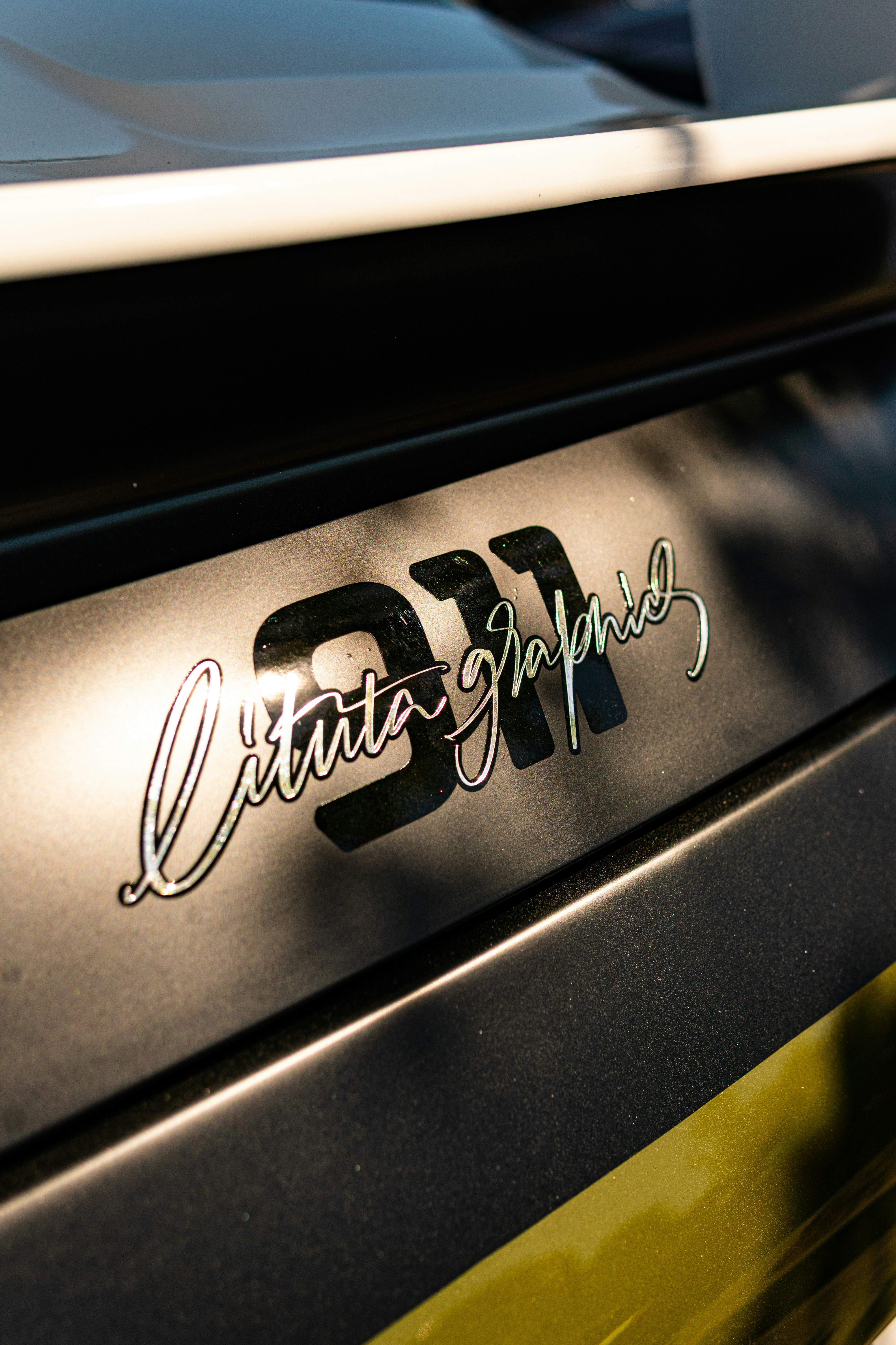 Chrome Script: The Metallic Badge Adorns a Stubborn Twilight