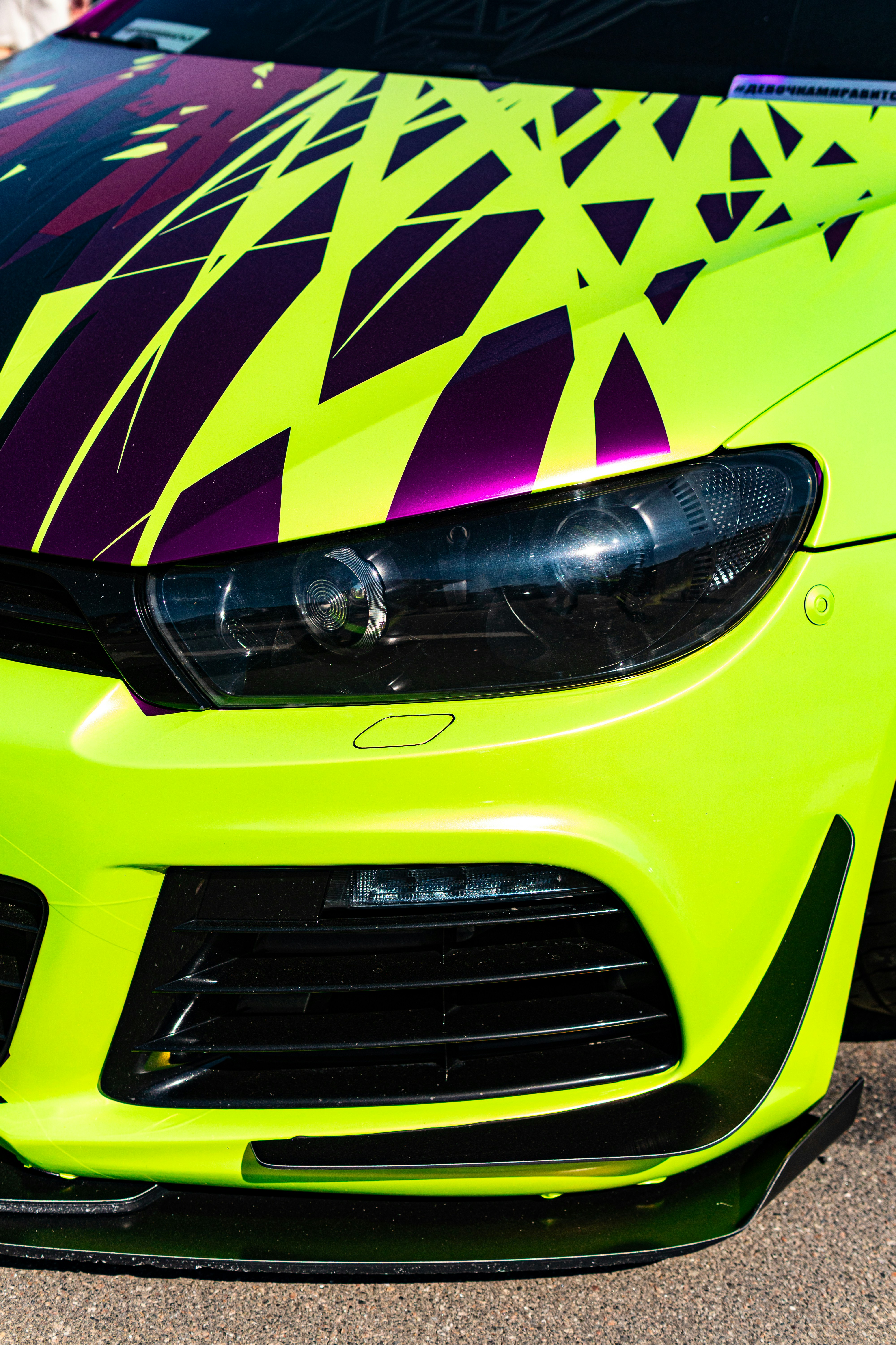 Neon Fury: Lime-Gold Car Hood with Geometric Purple Accents