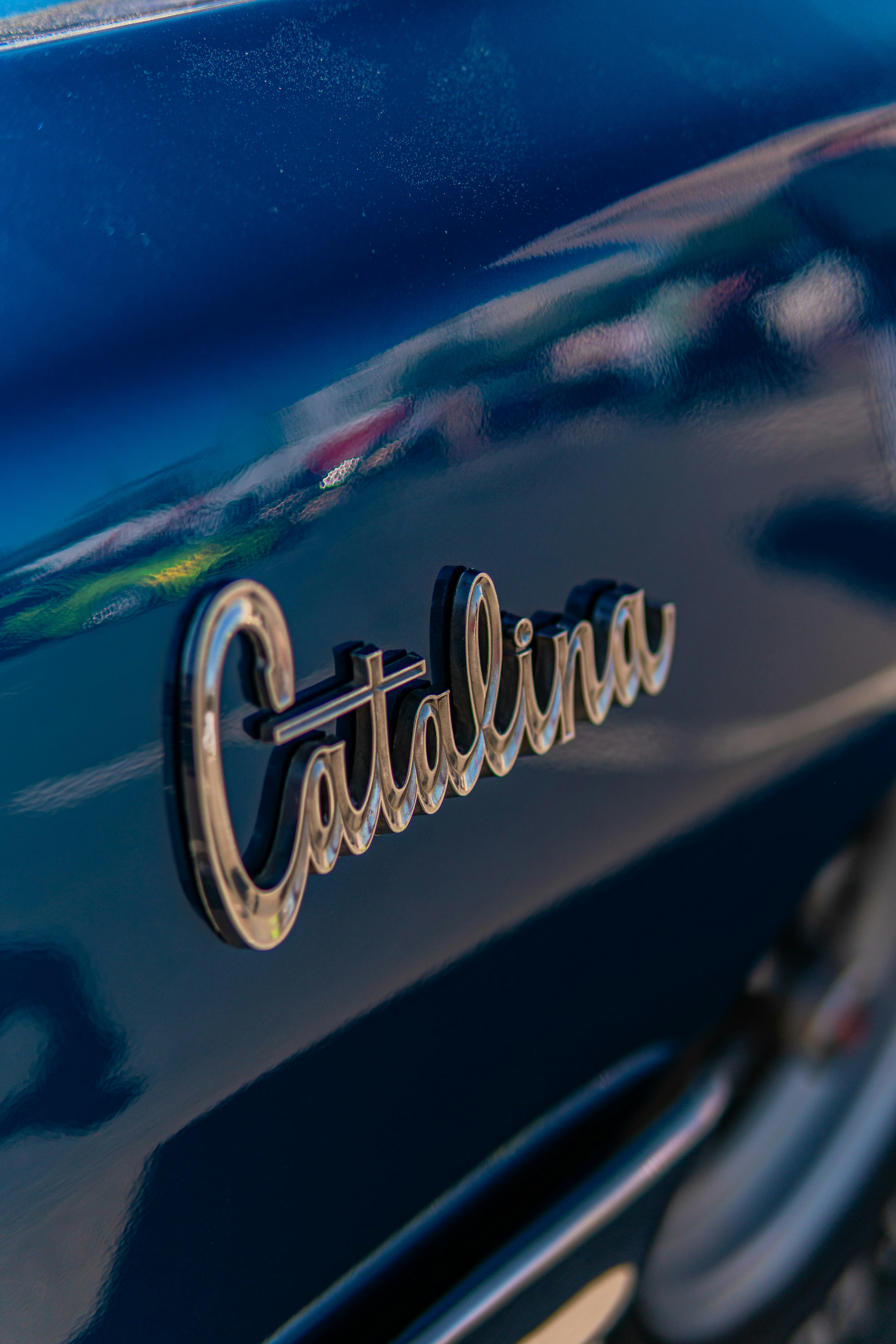 Cursive Chrome: the Cadillac Badge Reflects Race-Ready Metal