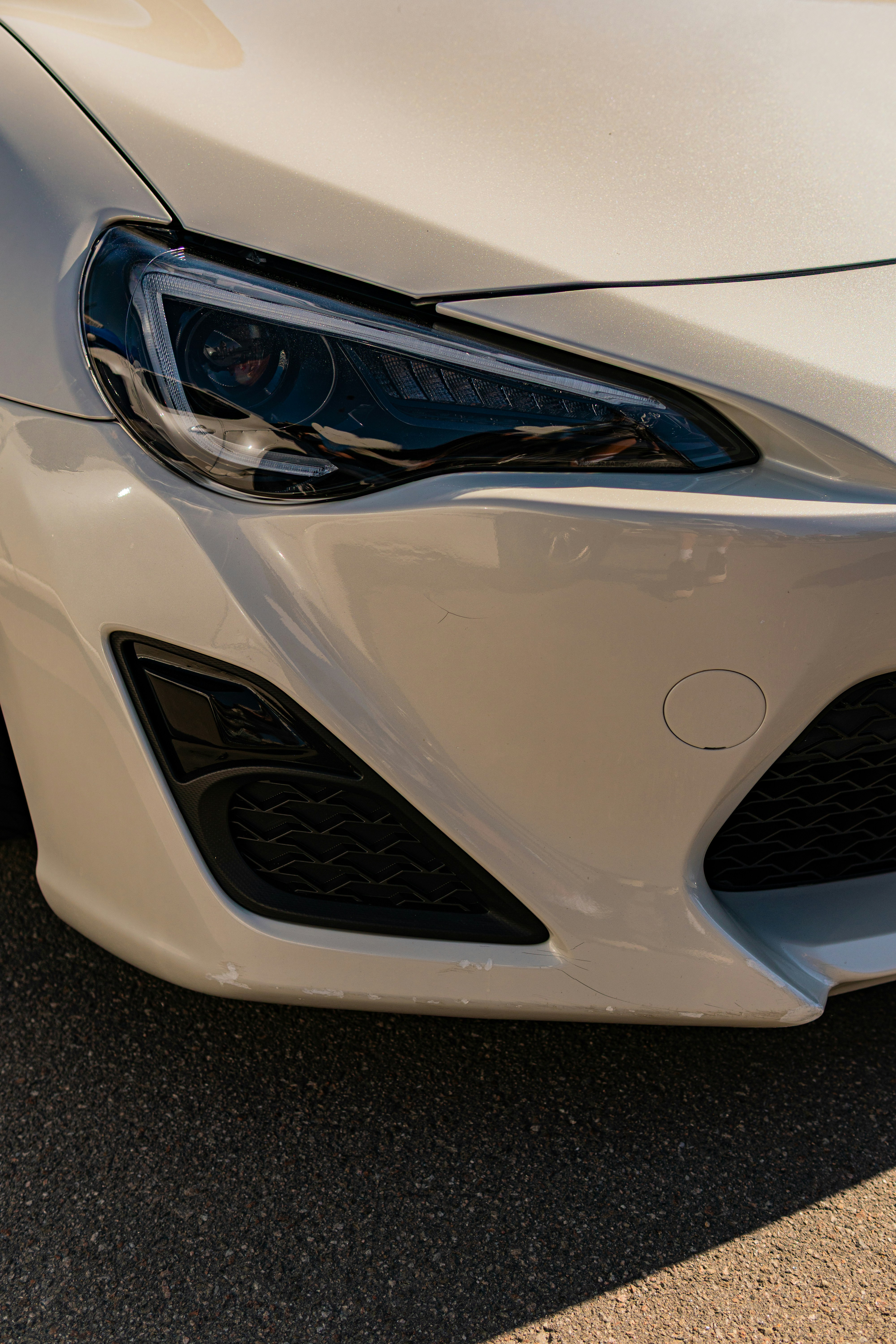 Close-Up of a Sports Car's Front Quarter with Sleek Headlight