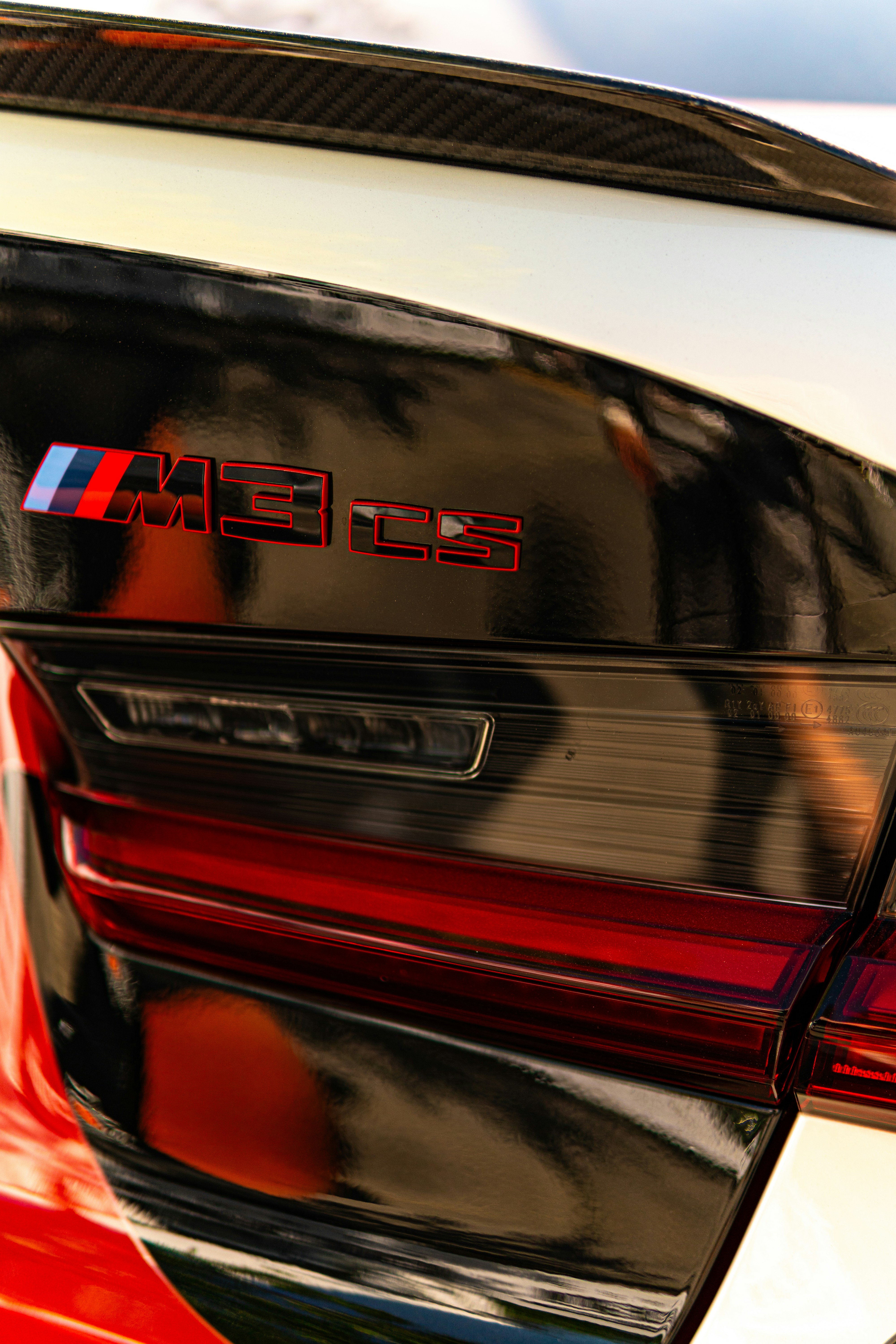 M Power Emblem on Glossy Trunk: Precision in Color andReflection
