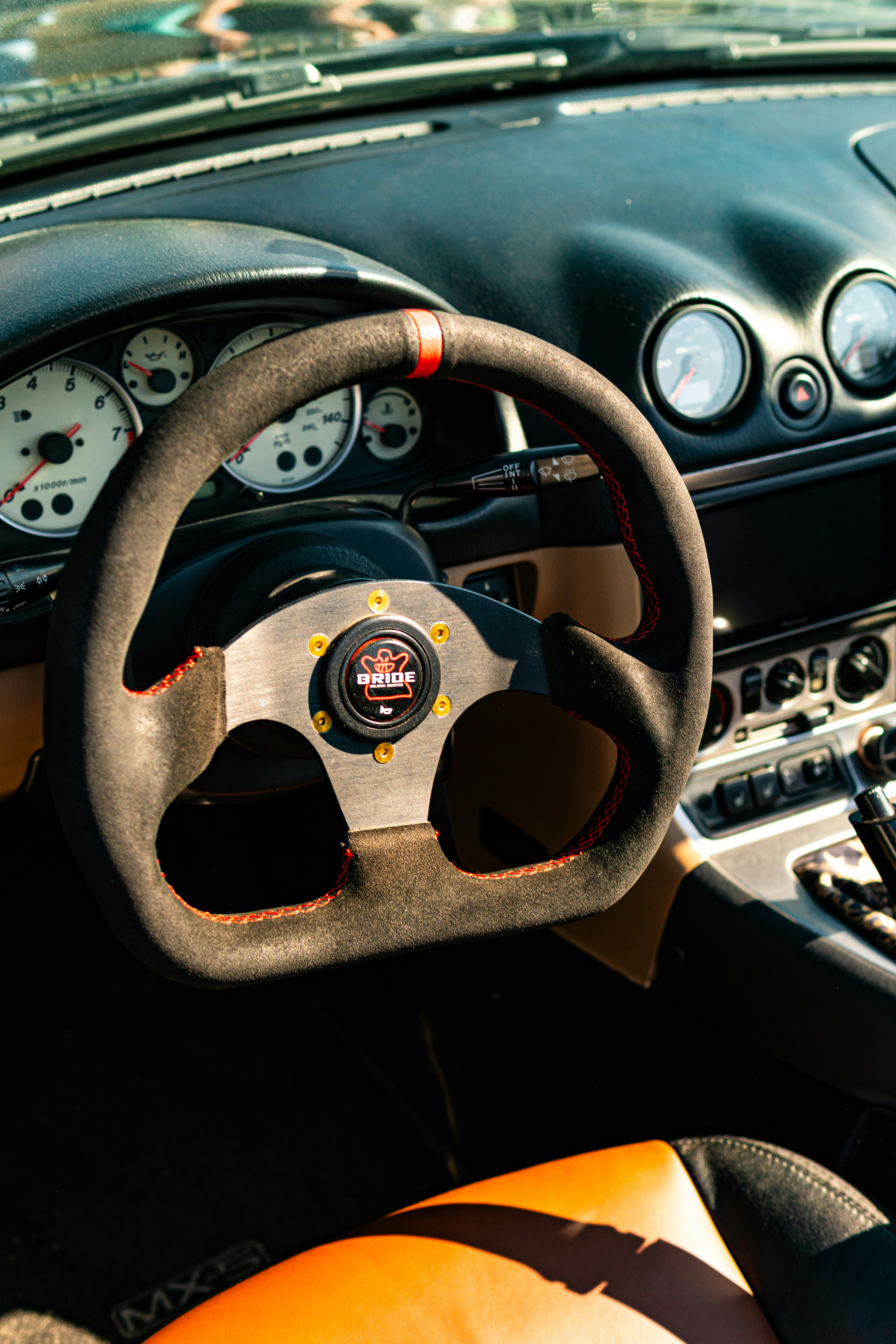 Race-Bred Grip: a shot of the cockpit’s suede steering wheel and tachometer