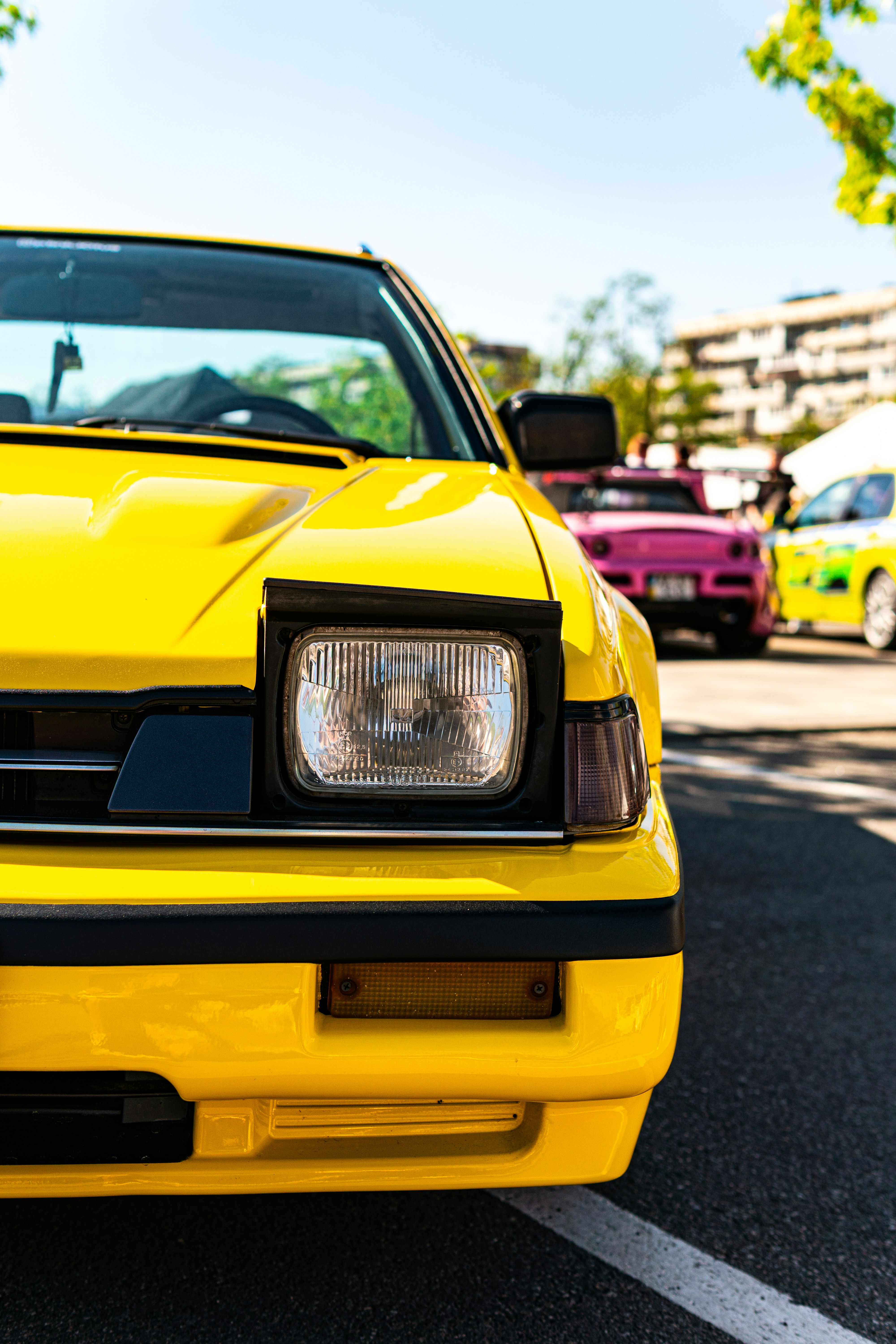 Chrome-glass Gaze: The Front View of a Neon-Yellow Classic