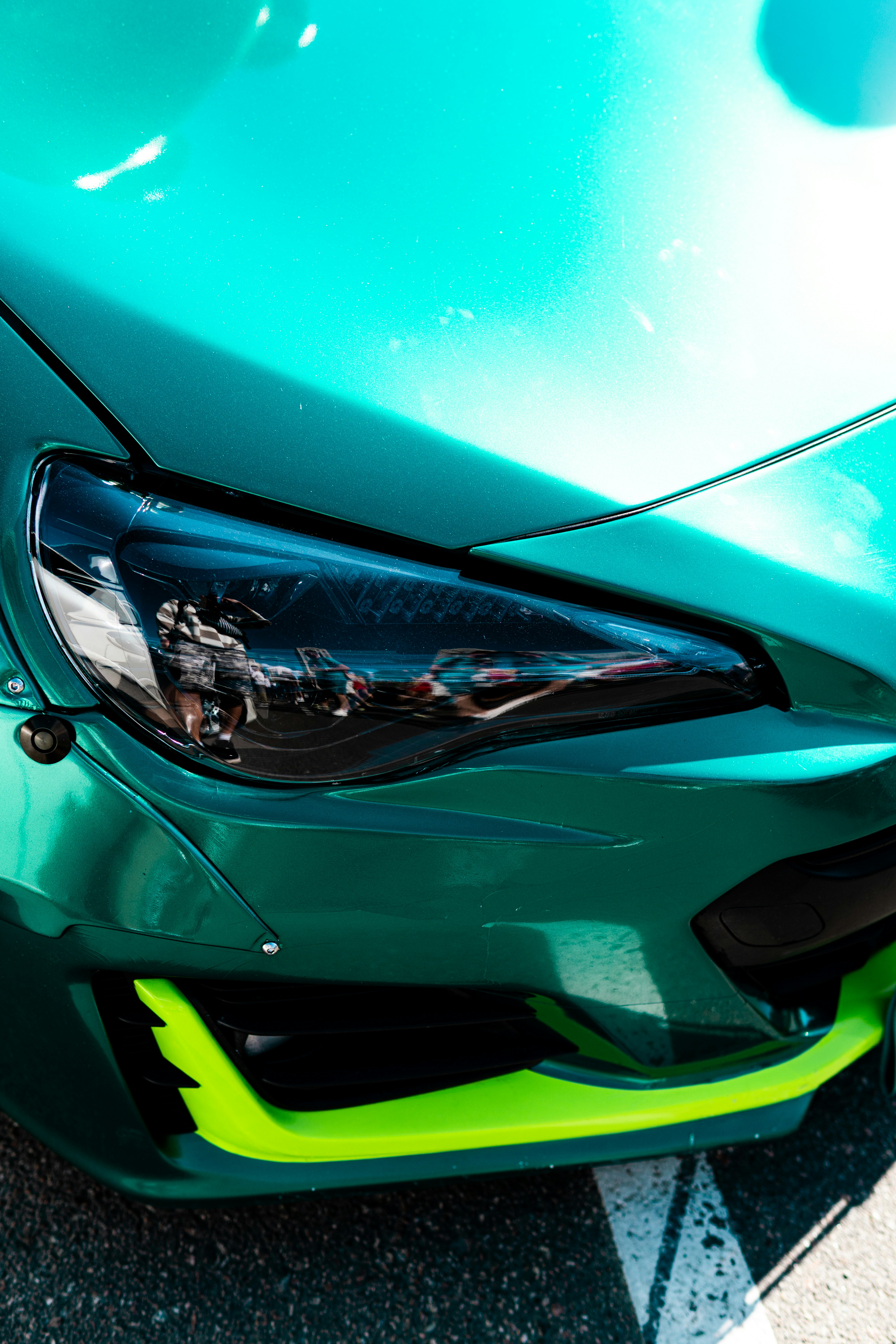 Emerald Velocity: Front Corner of a Citrus-Teal Car