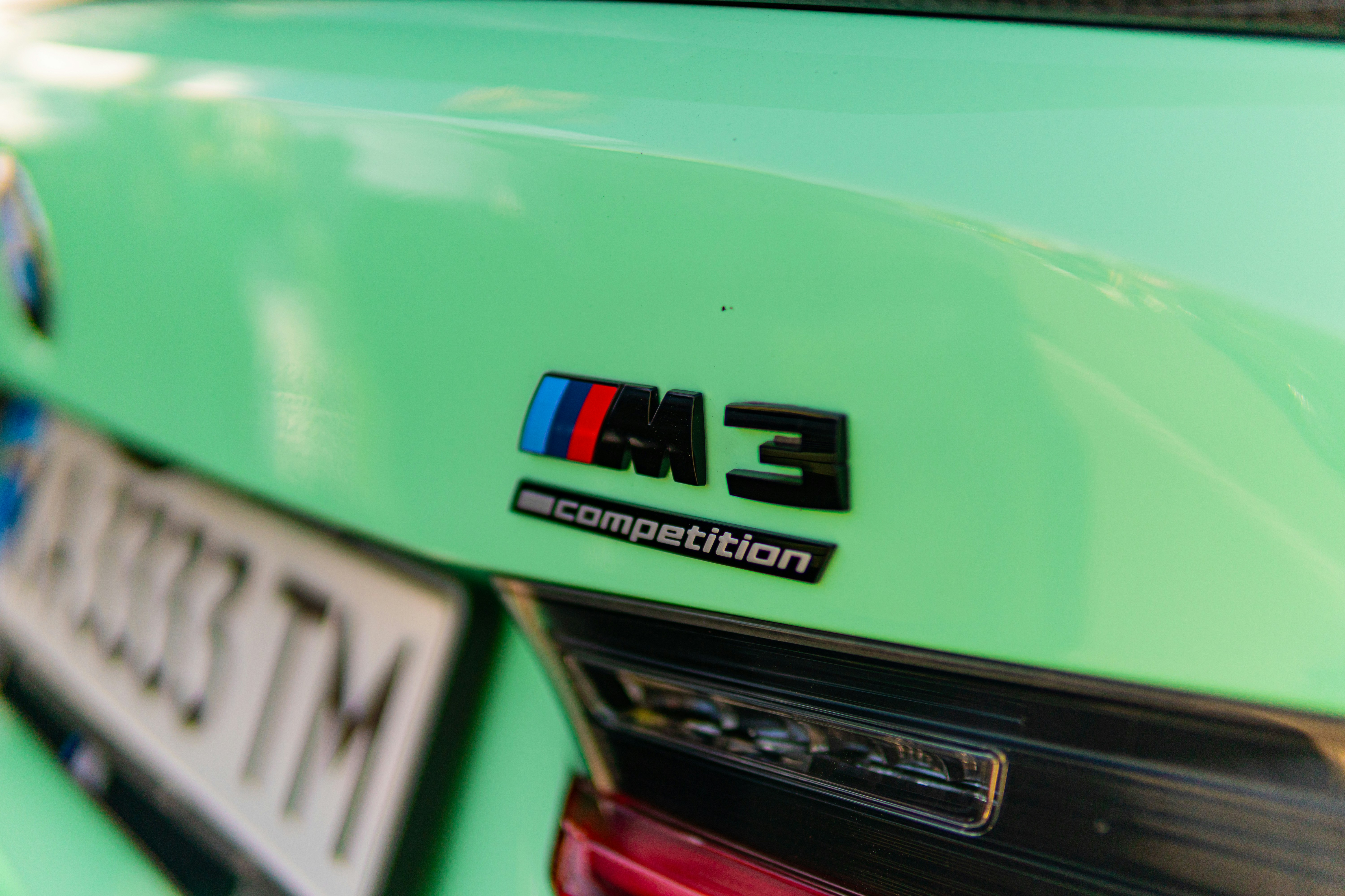 Mint Metallic M3 Badge: A Close-Up on Automotive Identity