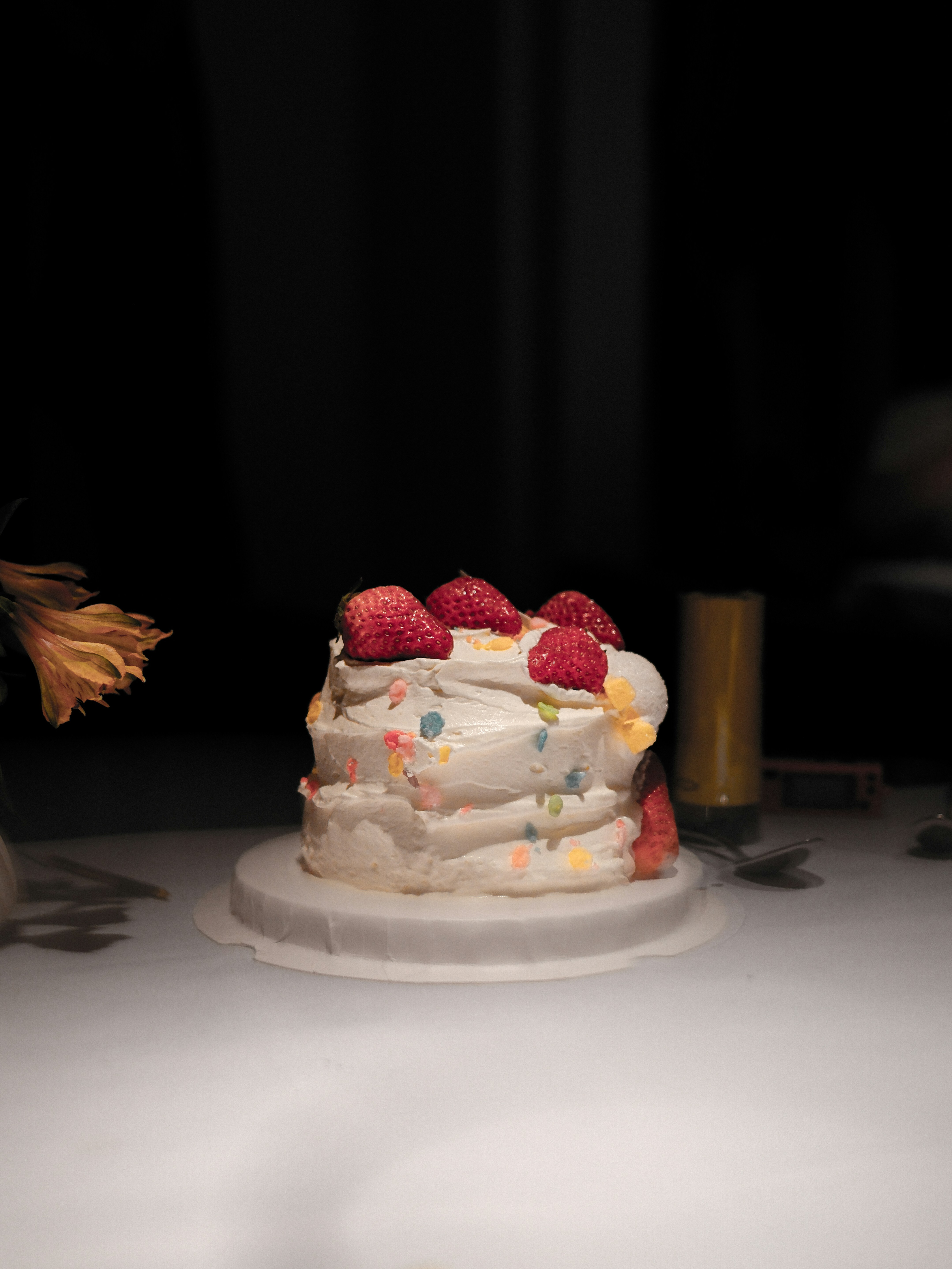 Sweet Spotlight: Raspberry Cake Under Gentle Dinner-Table Lights