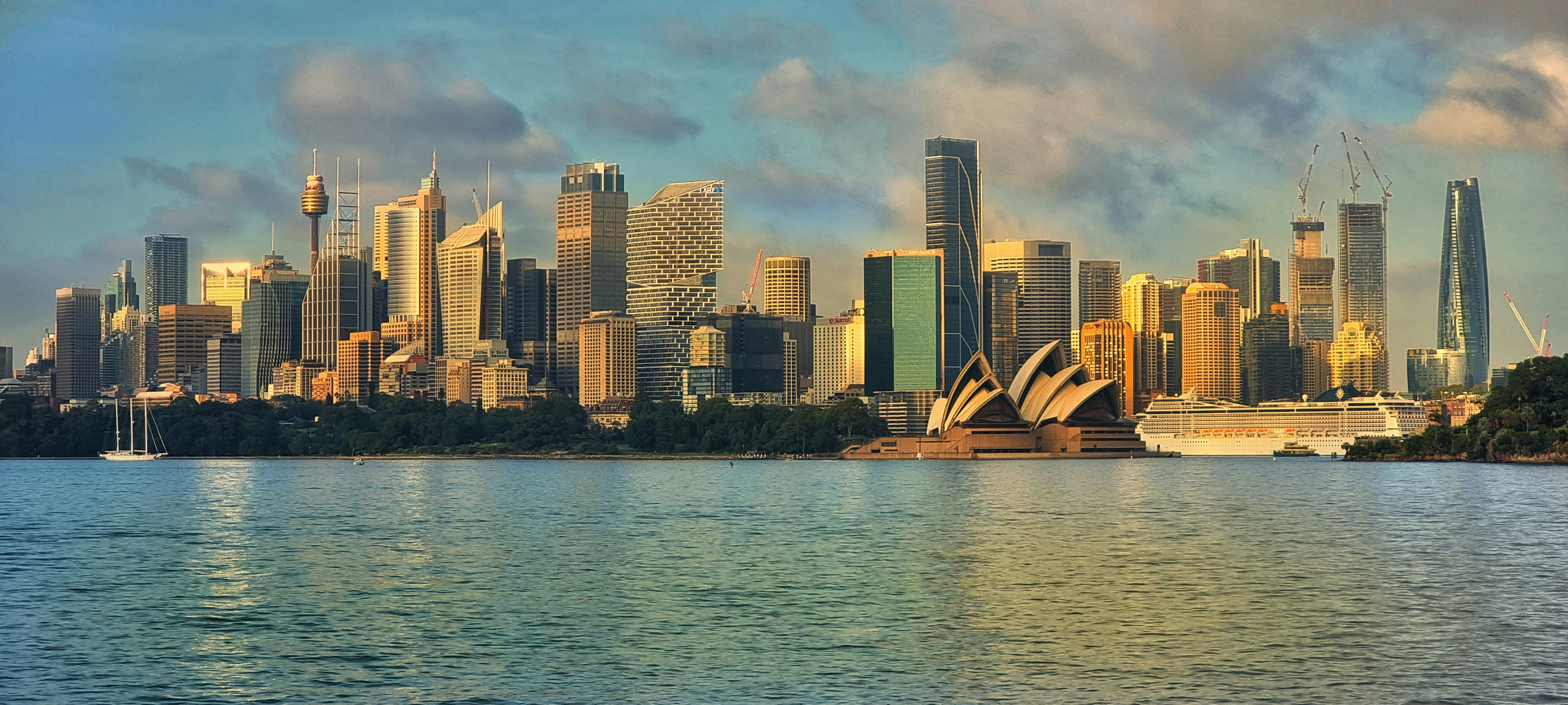 Sydney Skyline at Golden Hour: Opera House Silhouette over Harborside