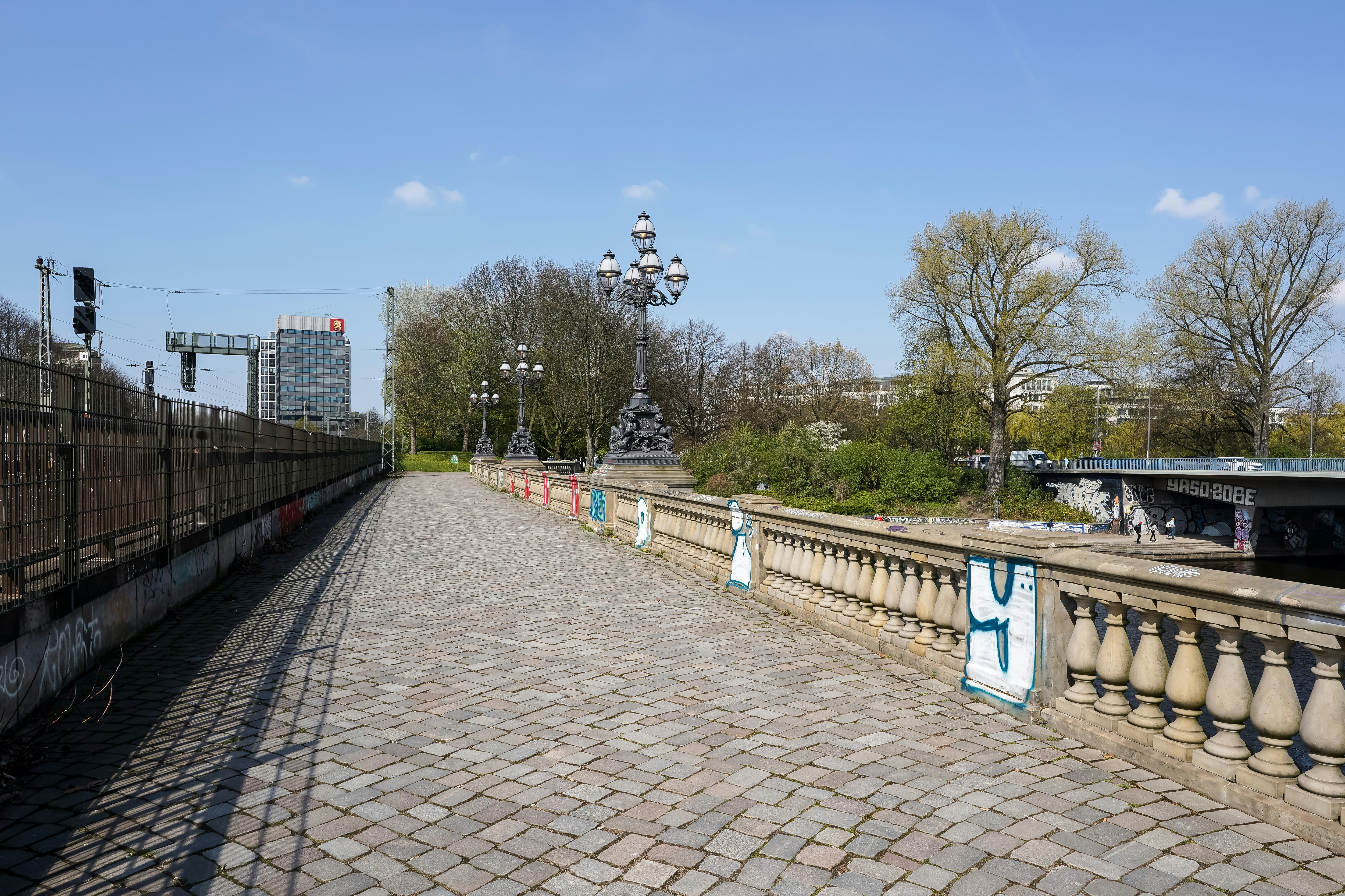 Evening on the City Bridge: Cobblestone Path to the Park