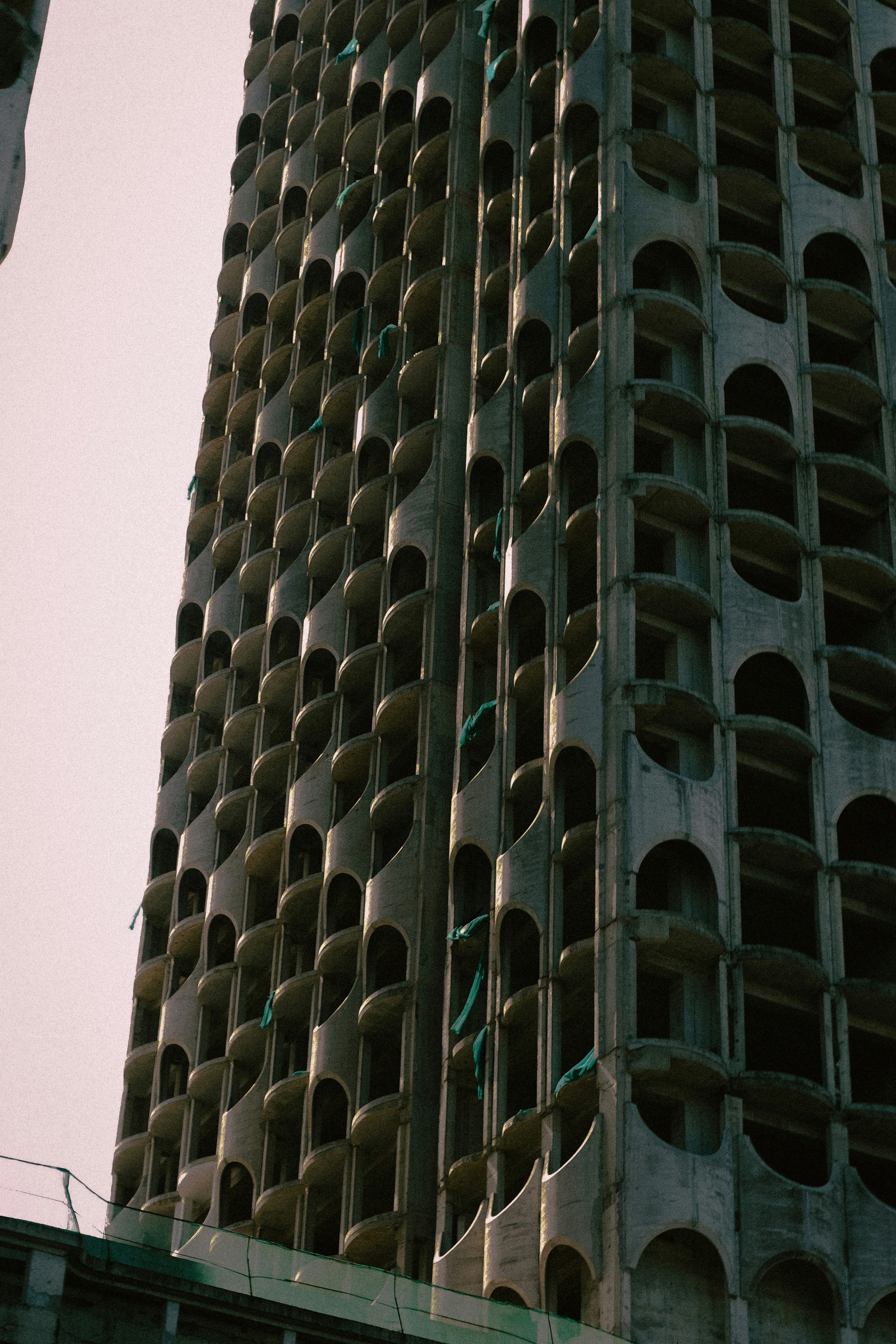 Vertical Gridwork: The Repeating Arches of Concrete Echoed in Twilight