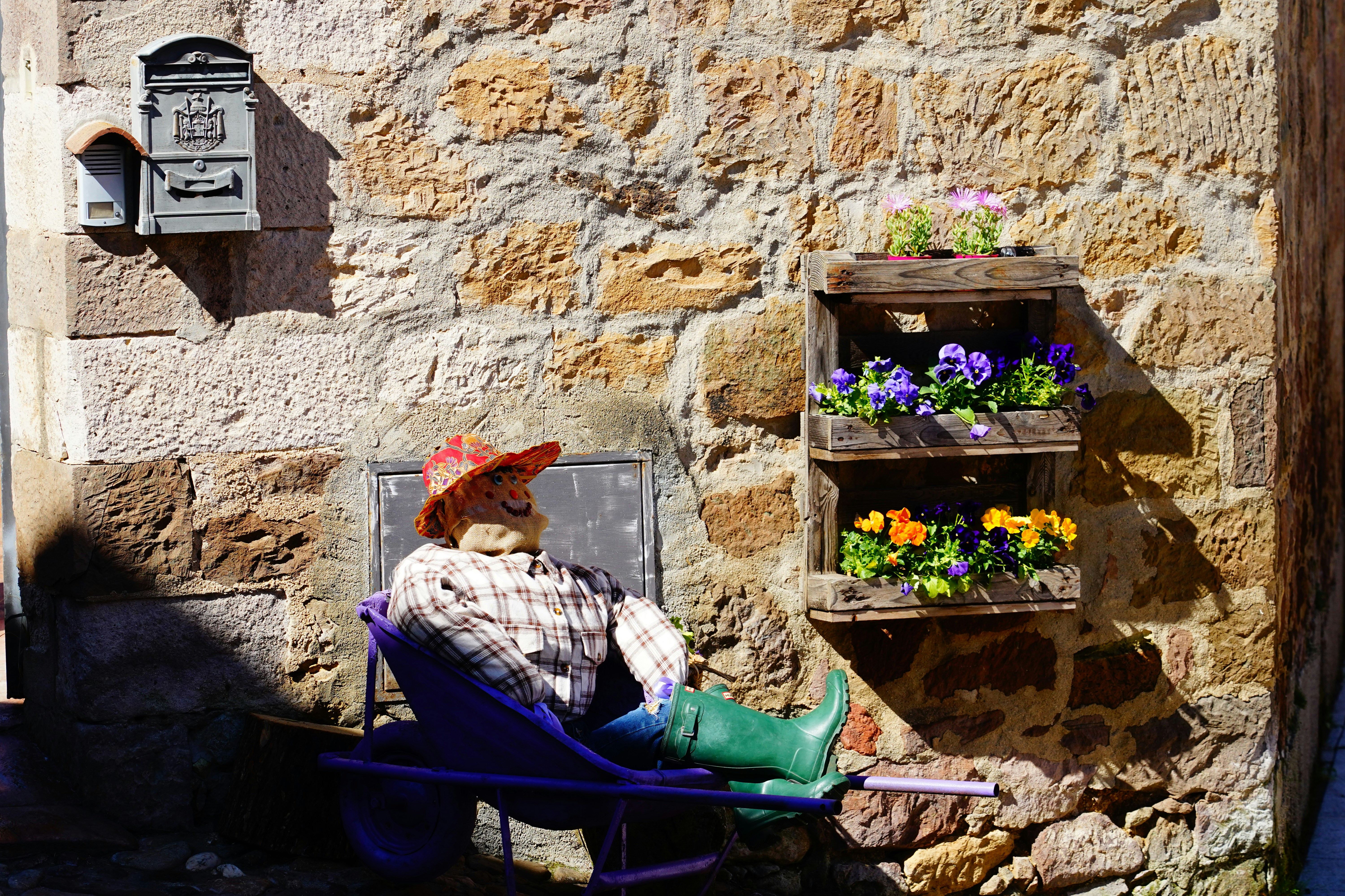 Sunlit Reclining Gardener in a Stone Courtyard