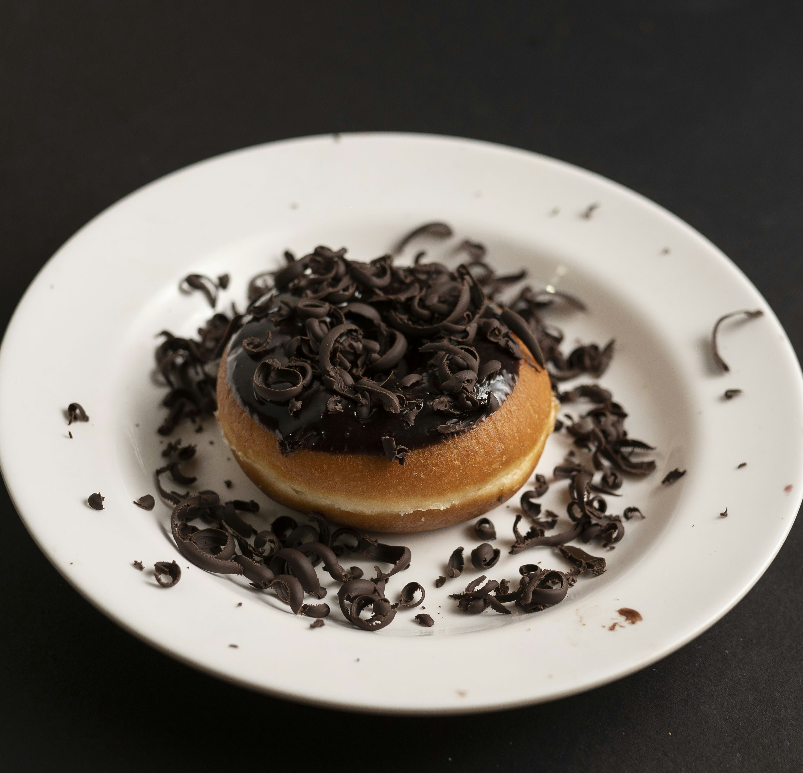 Glossy Chocolate Mavorite: A Donut Crowned with Dark Shavings