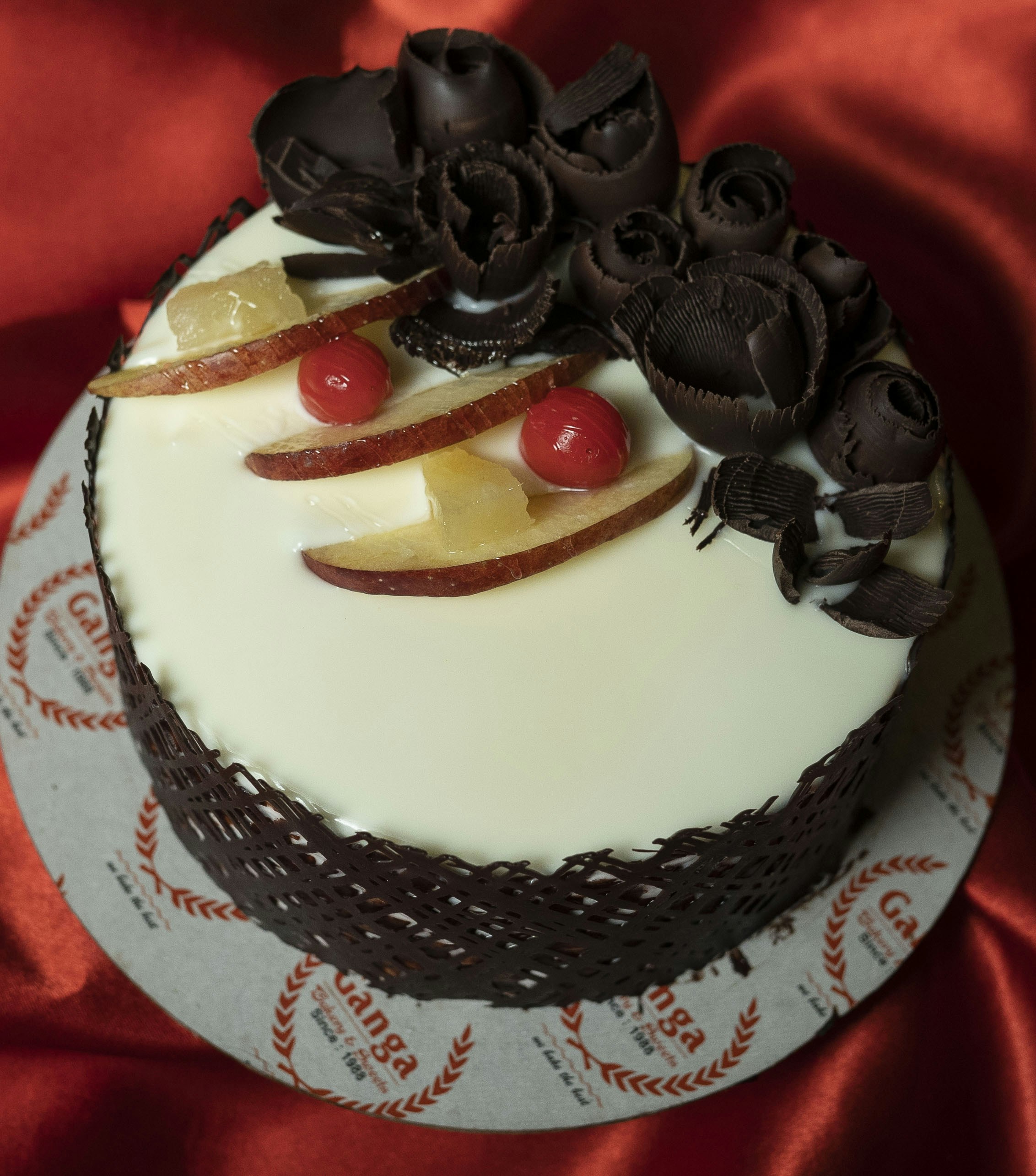 Ornate Chocolate Fleur Cake with Dark Lattice and White Icing