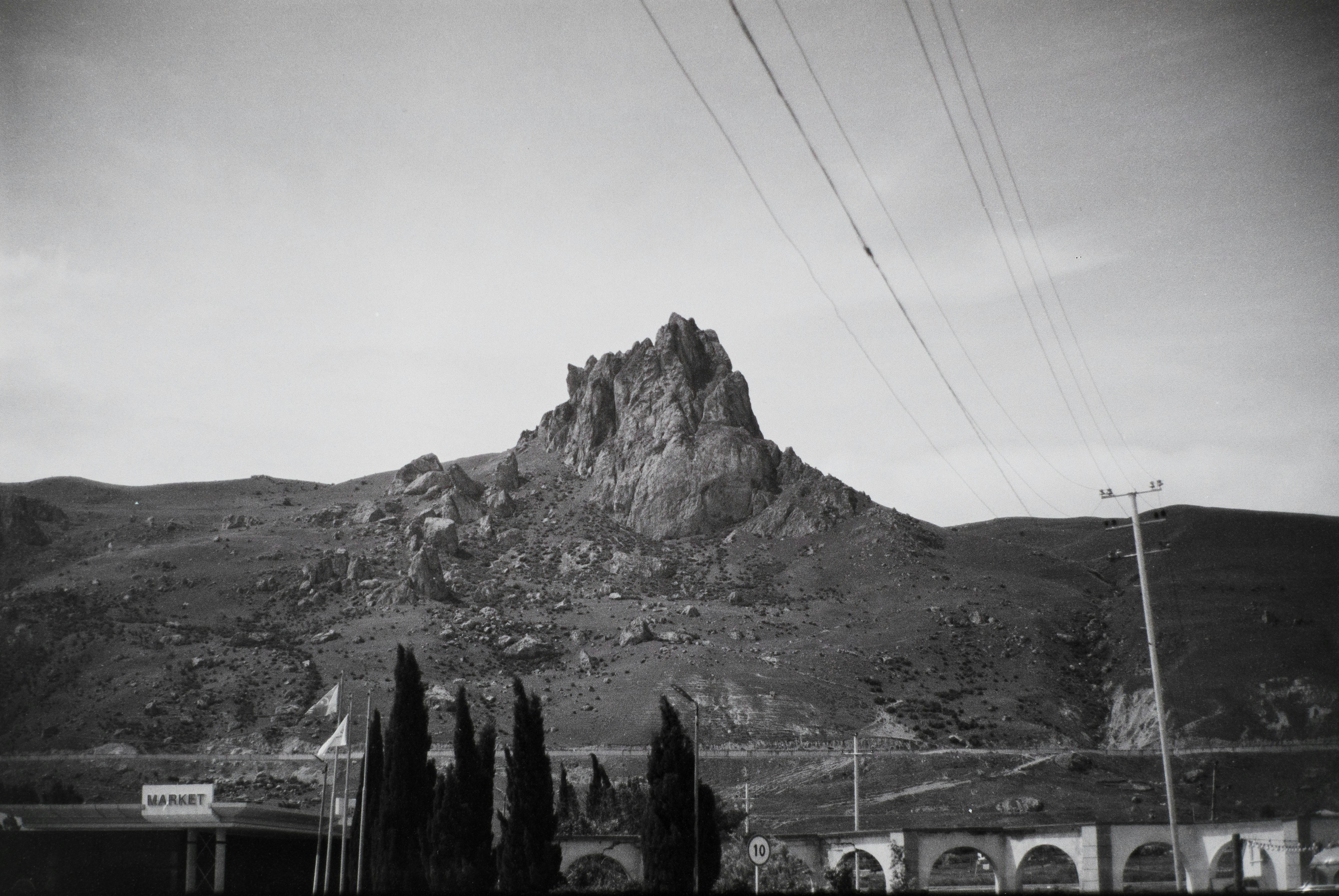 Stone Sentinel Over a Quiet Arcada
