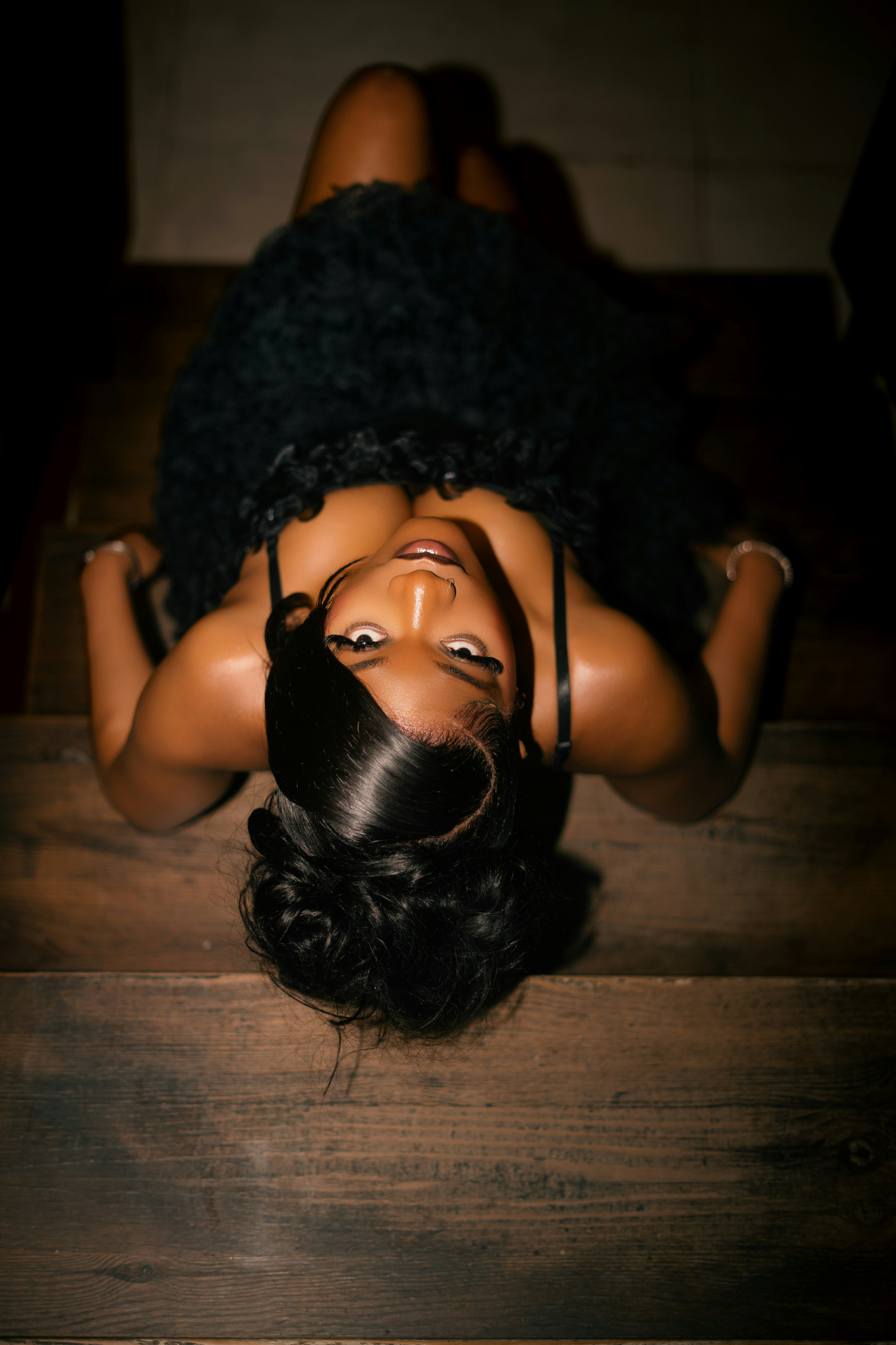 Downward Gaze: A Portrait on Velvet Steps