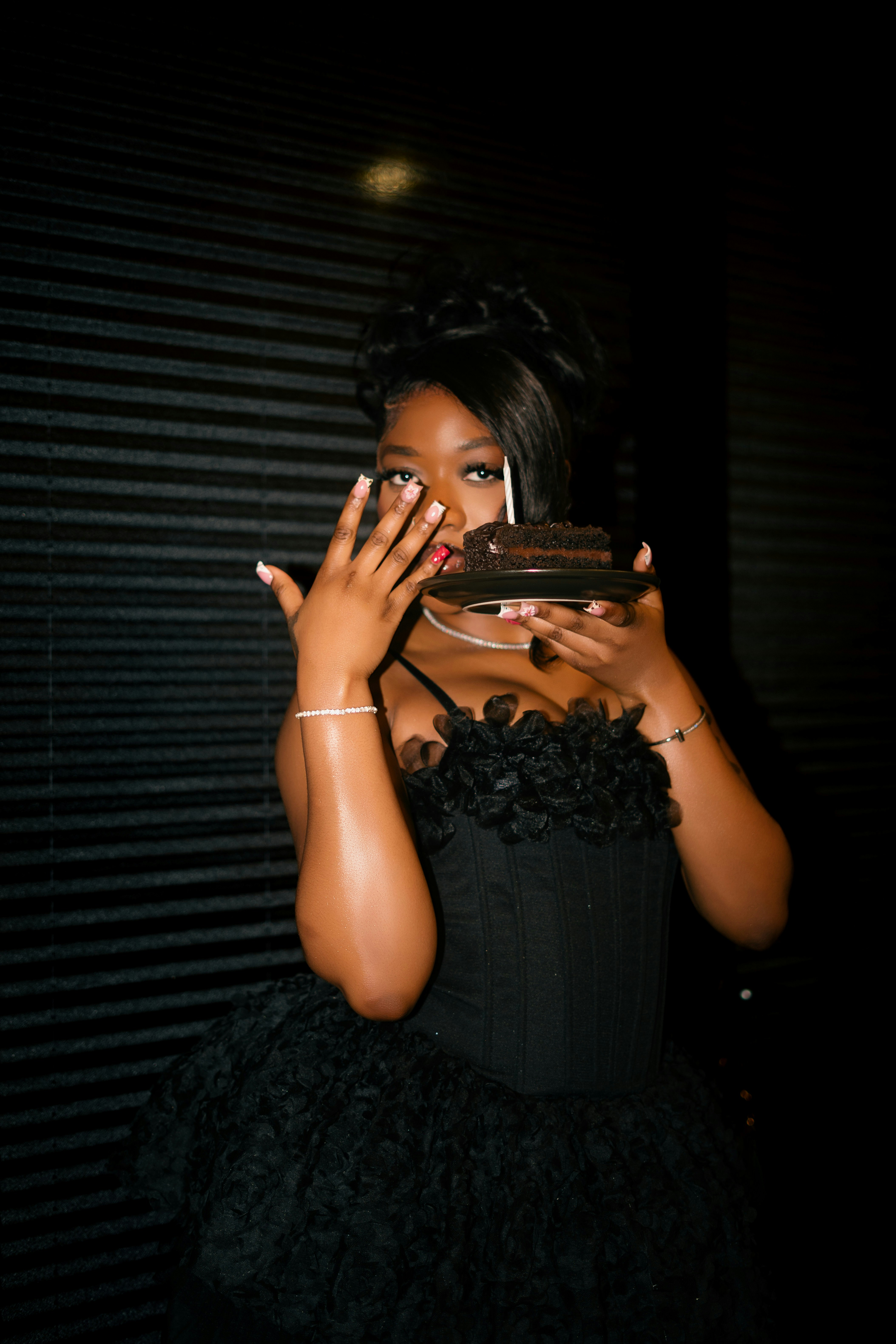 Midnight Velvet: A Sweet Spotlight on a Cake-Toting Moment