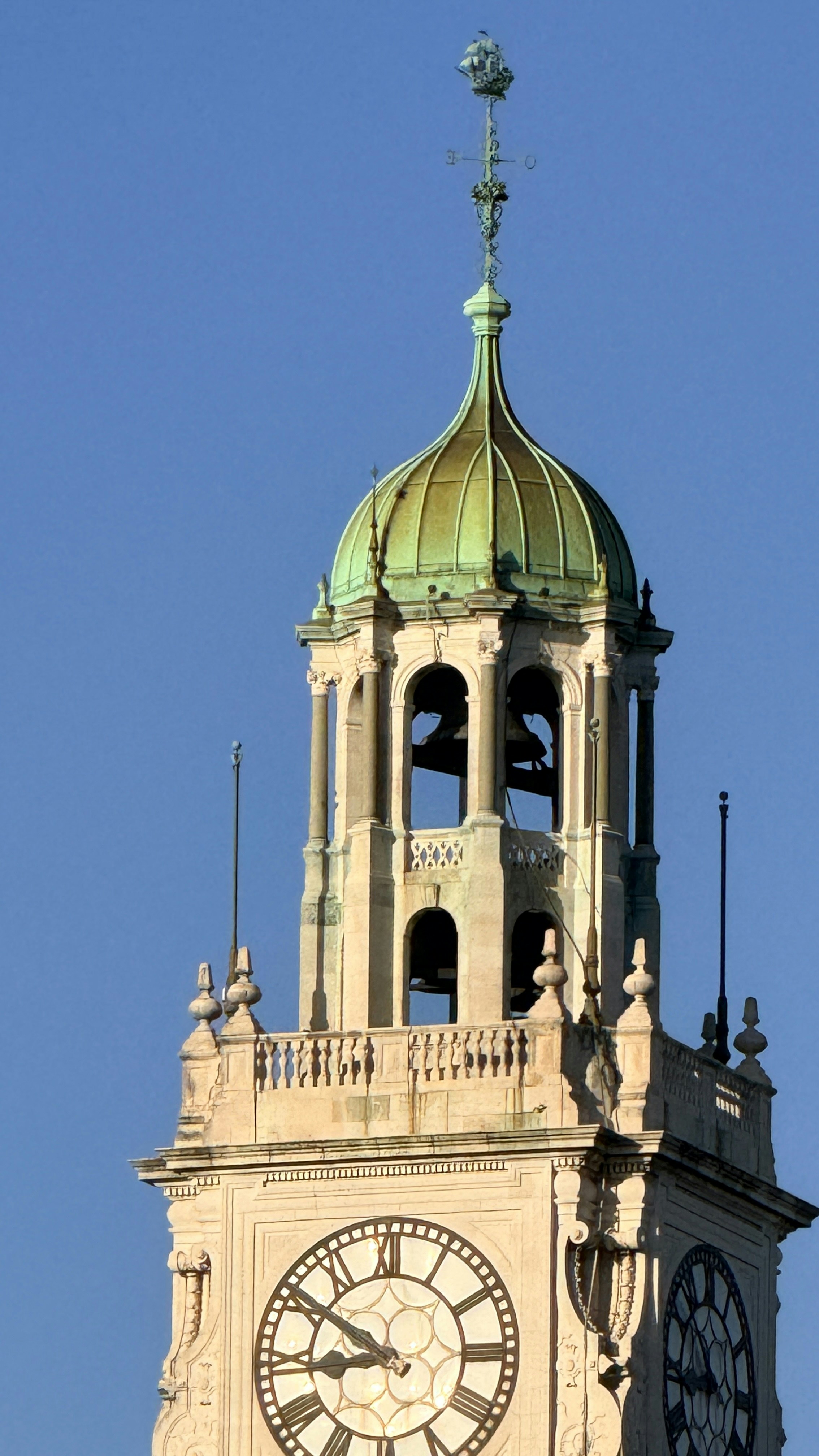Clocktower soars against a clear blue sky