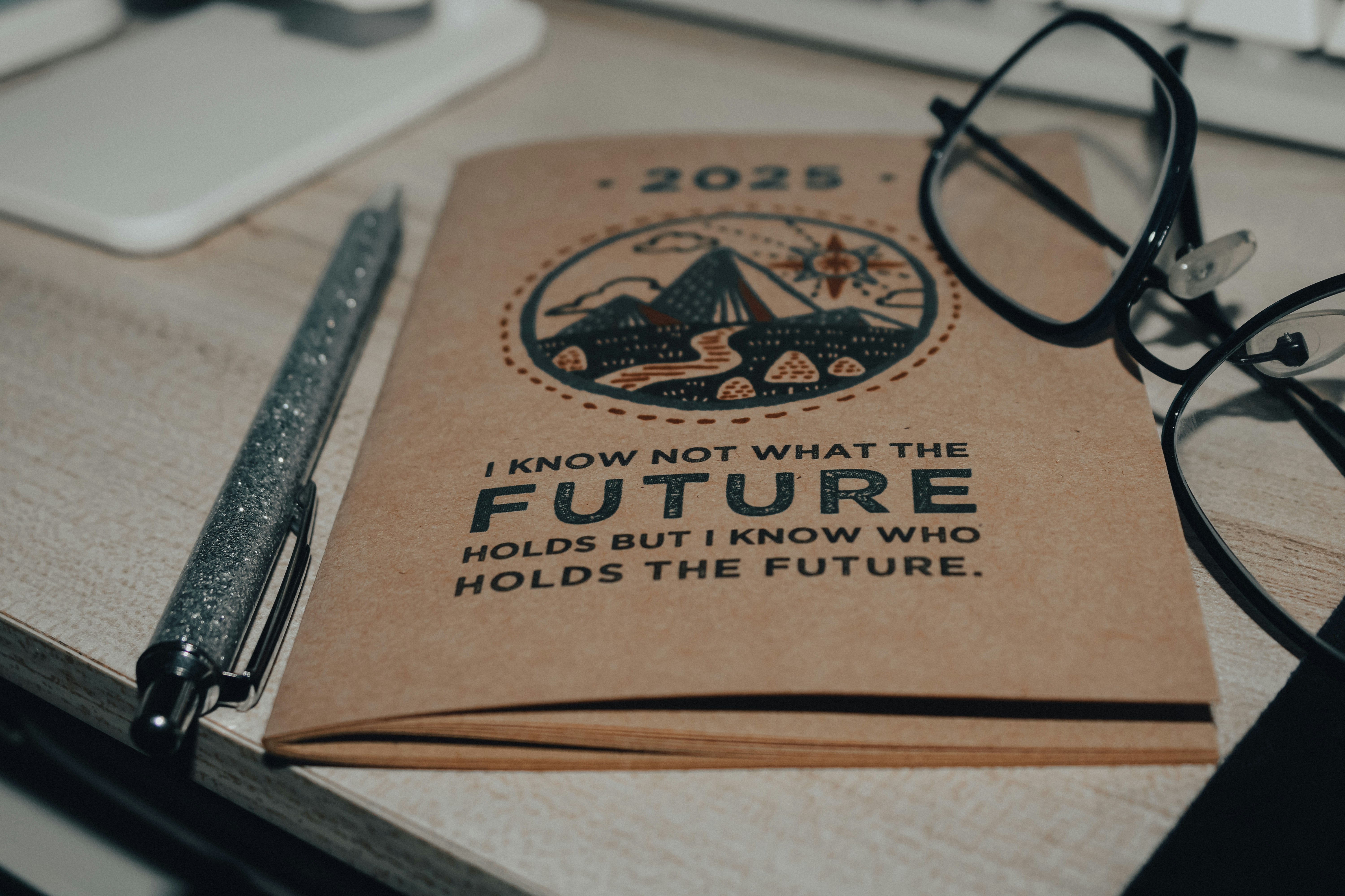 Future in Focus: Notebook and Glasses Rest on a Desk