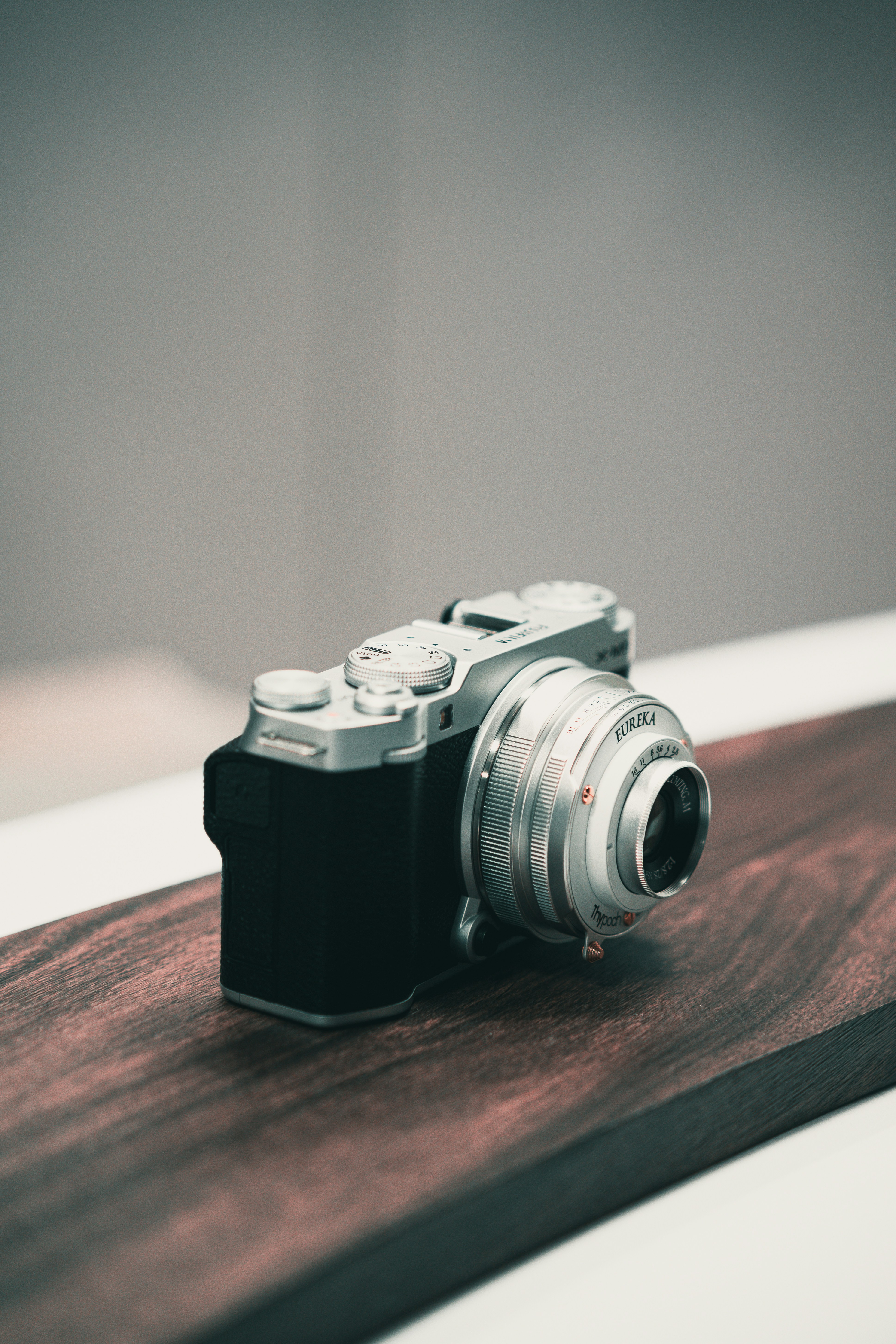 Vintage Mirror: A Compact Classic Resting on Wood