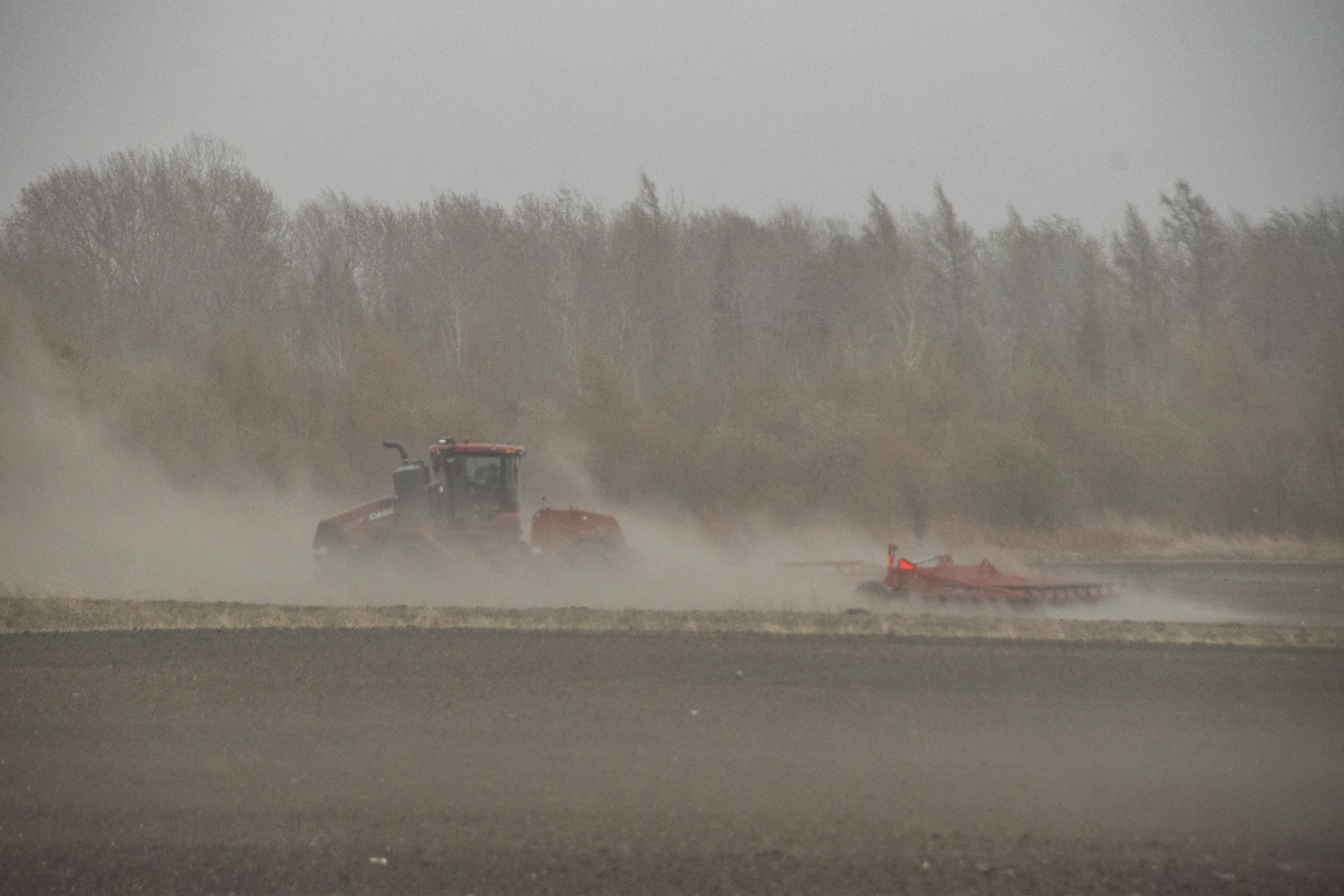 Tractor in Mist: Fieldwork Amidst Quiet Dawn